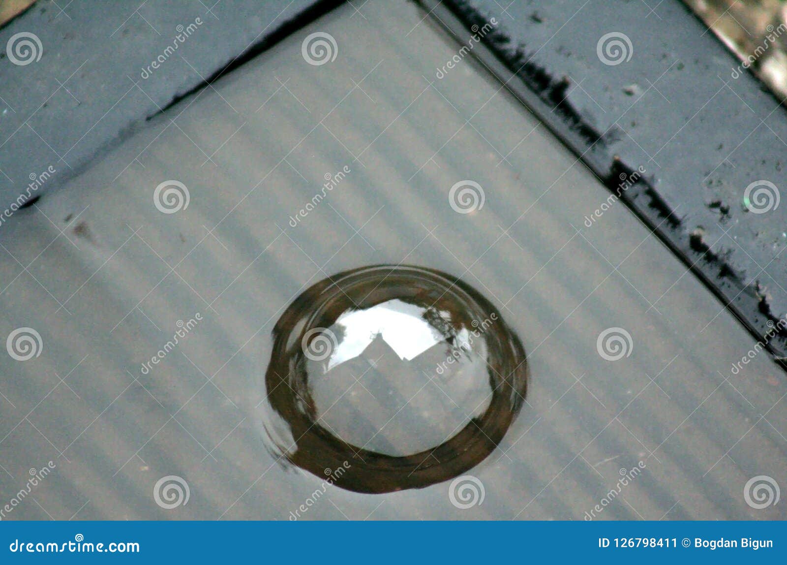 Rain Bubble in a Puddle on a Mat. Stock Image - Image of wiping ...