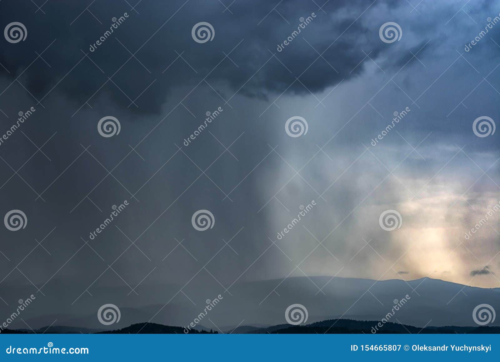 The Rain from the Clouds Gradually Covers the Mountains Stock Image ...