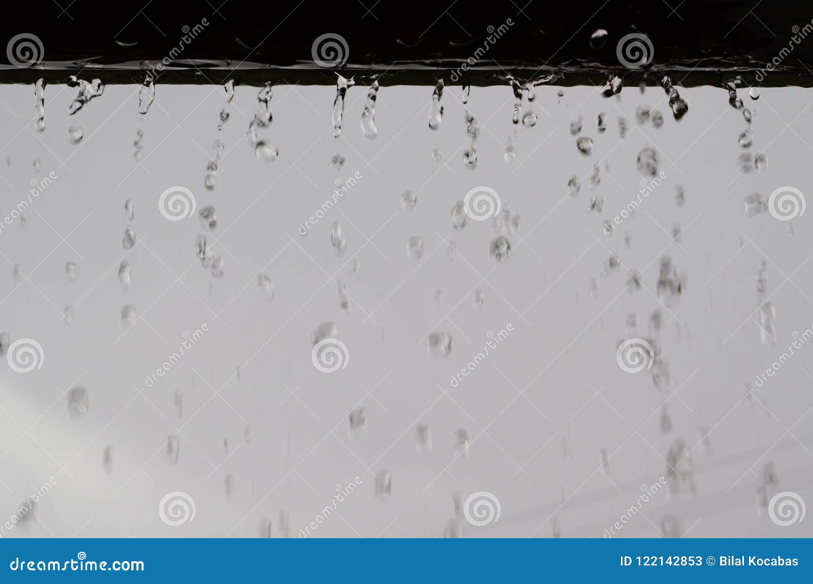 Rain Drops Fall from the Roof End Eave Stock Image - Image of slow ...