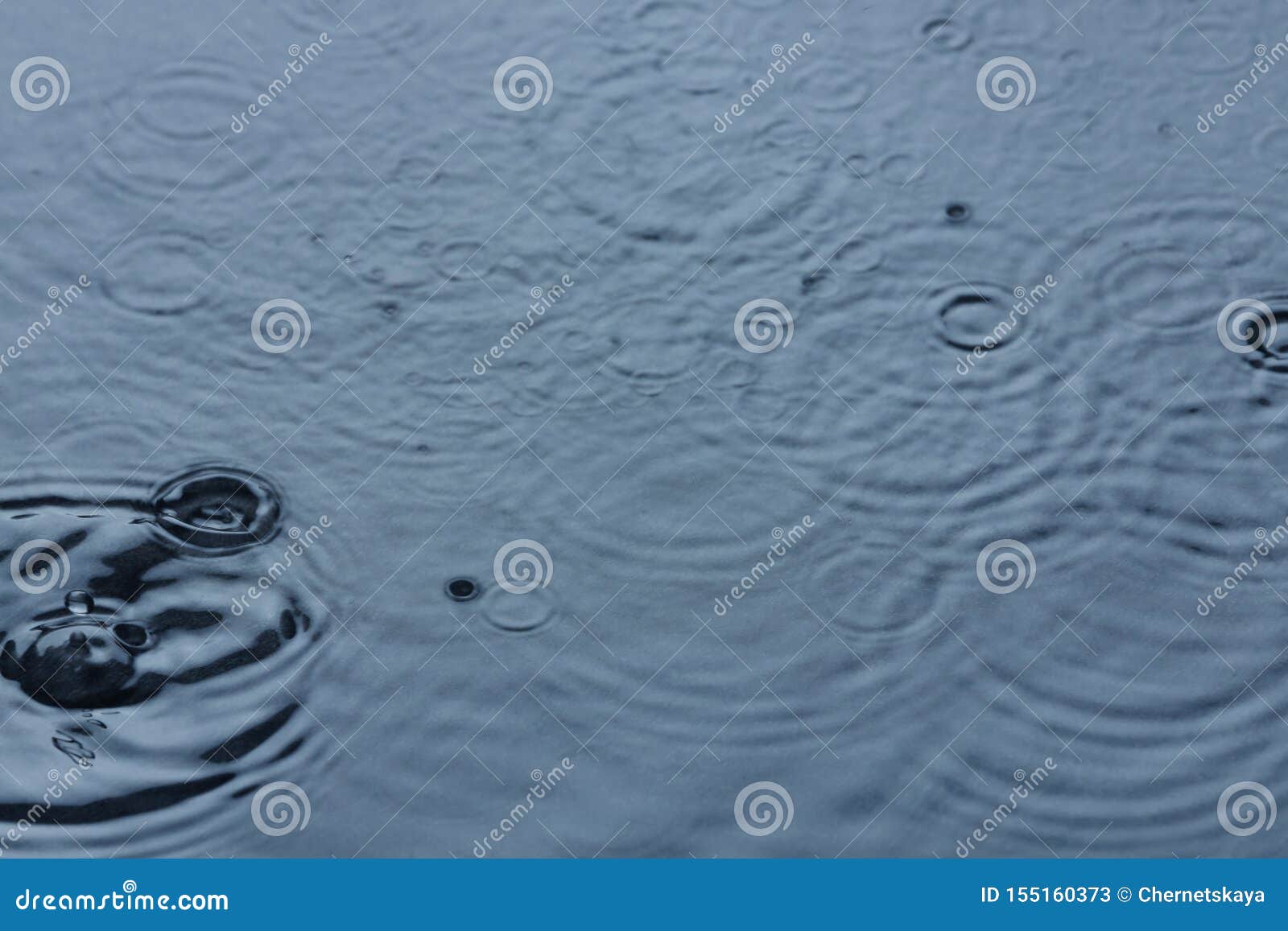 Rain Drops Falling Down into Puddle Stock Image - Image of puddle ...