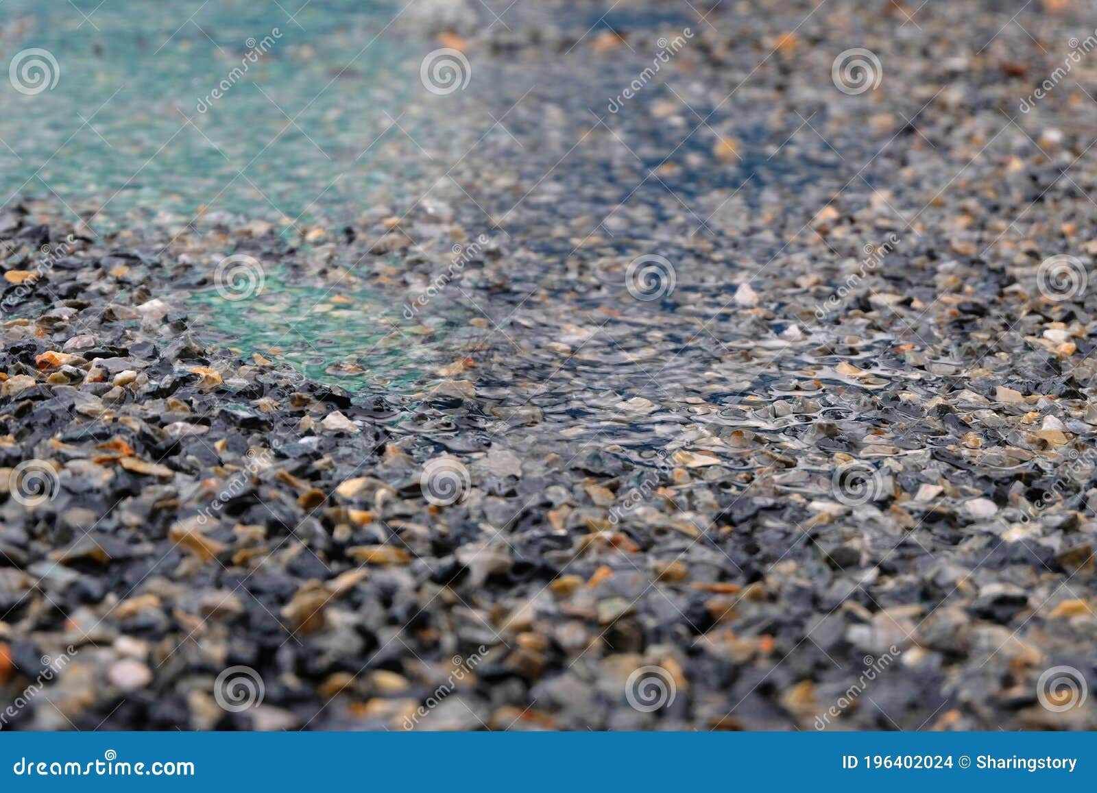 Rain Drops Rippling in a Puddle Stock Photo - Image of rock, urban ...