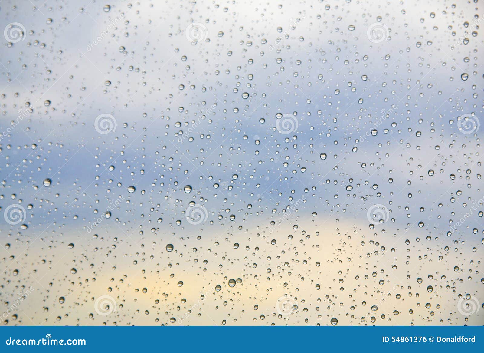 Rain Drops on a Window with Blue Sky in the Background Stock Photo ...