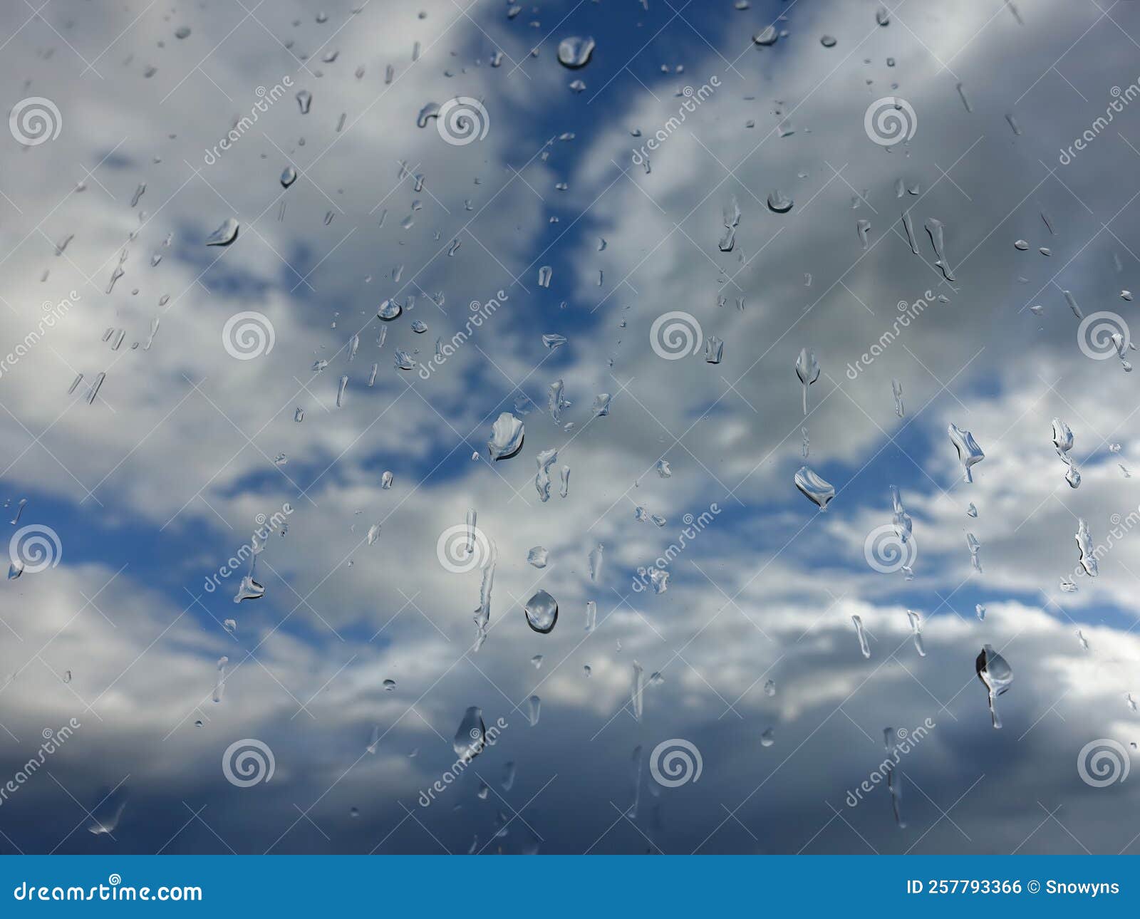 Rain Drops on the Window with Clouds and Sky Background Stock Photo ...