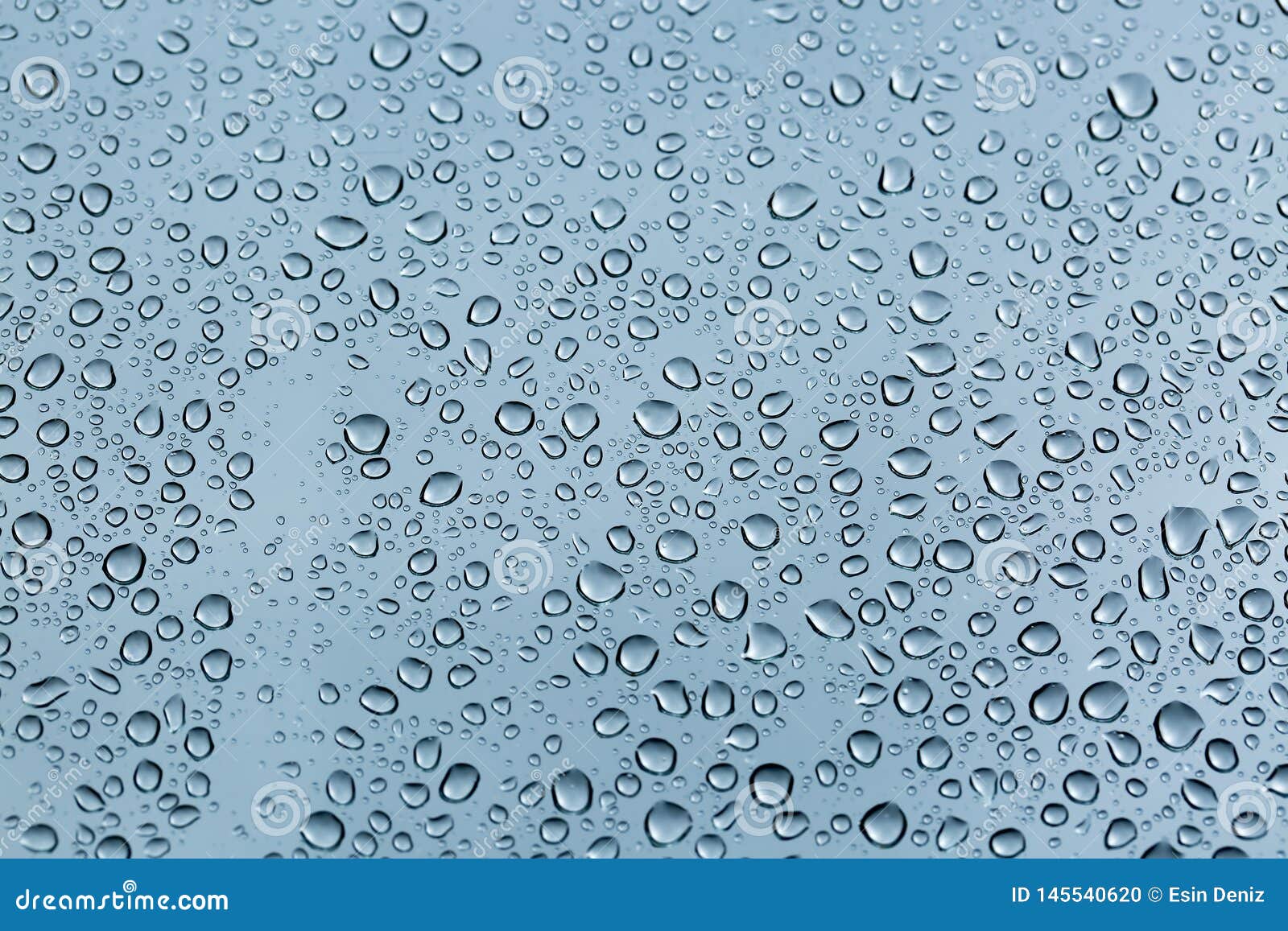Rain Drops on Window Glasses Surface with Cloudy Background . Natural ...