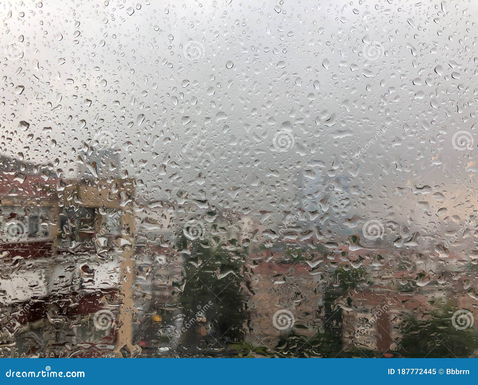 Rain Drops on a Window Pane Against City View Stock Image - Image of ...