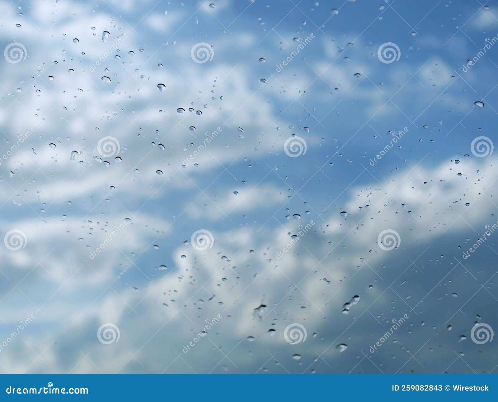 Rain Drops on the Windshield with Cloudy Sky Background Stock Image ...