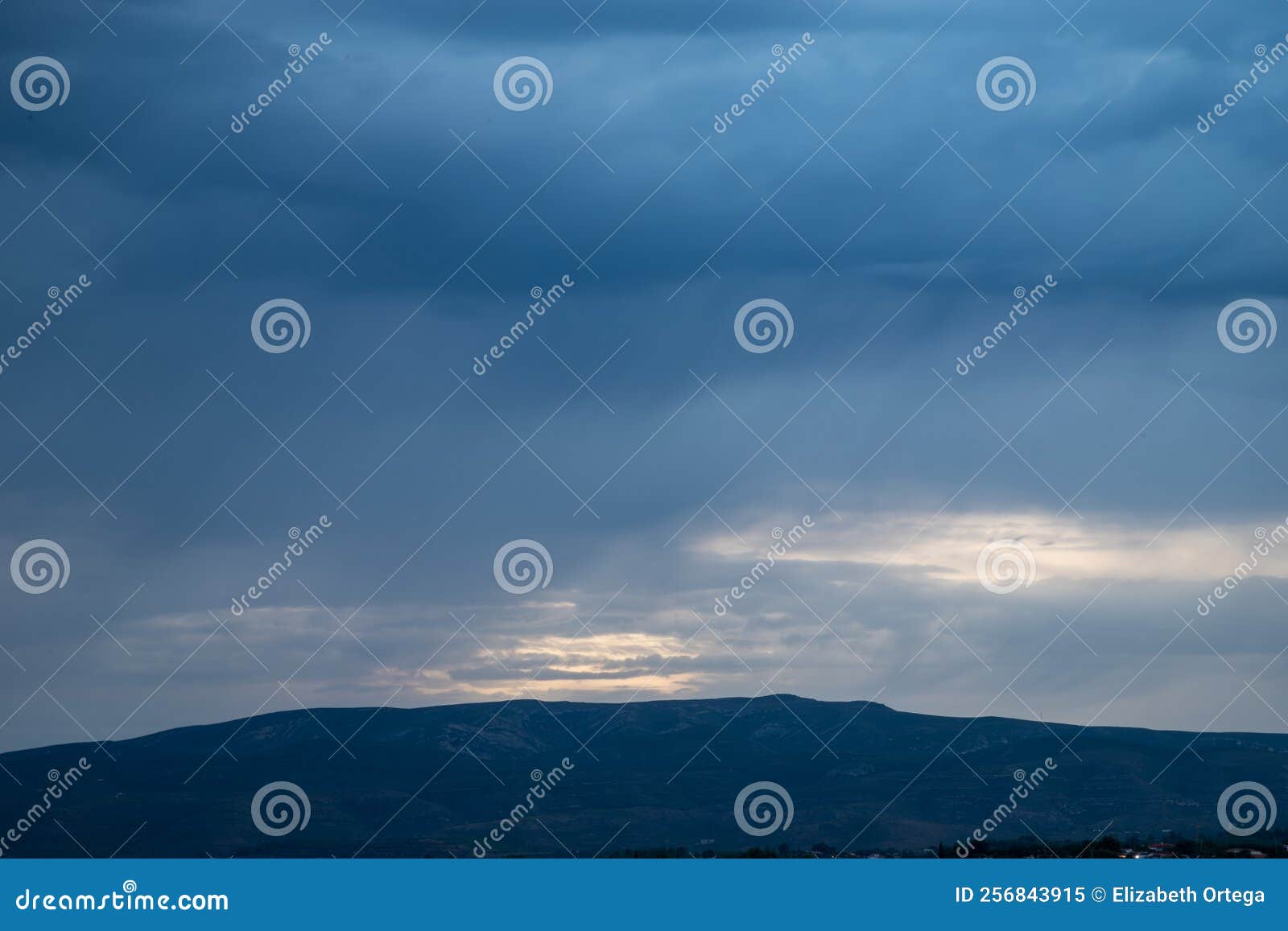 Rain Falling in the Distance with the Last Rays of the Sun Stock Image ...