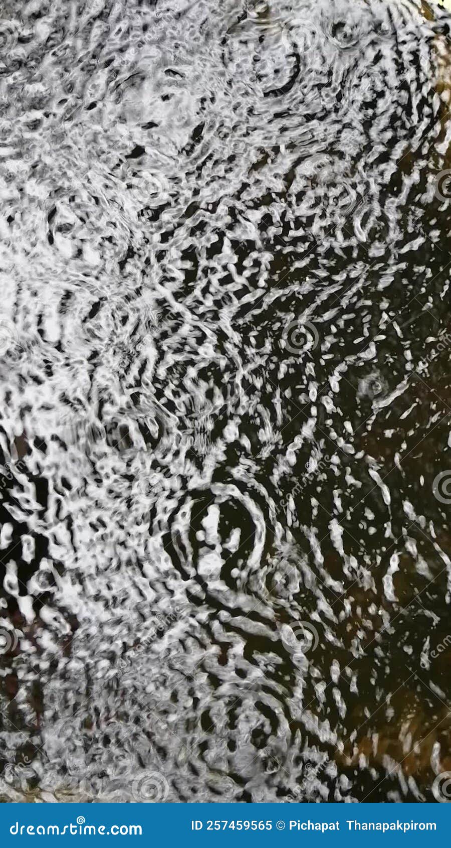 Rain Falling on Water Surface Creating Beautiful Water Ripples Stock ...