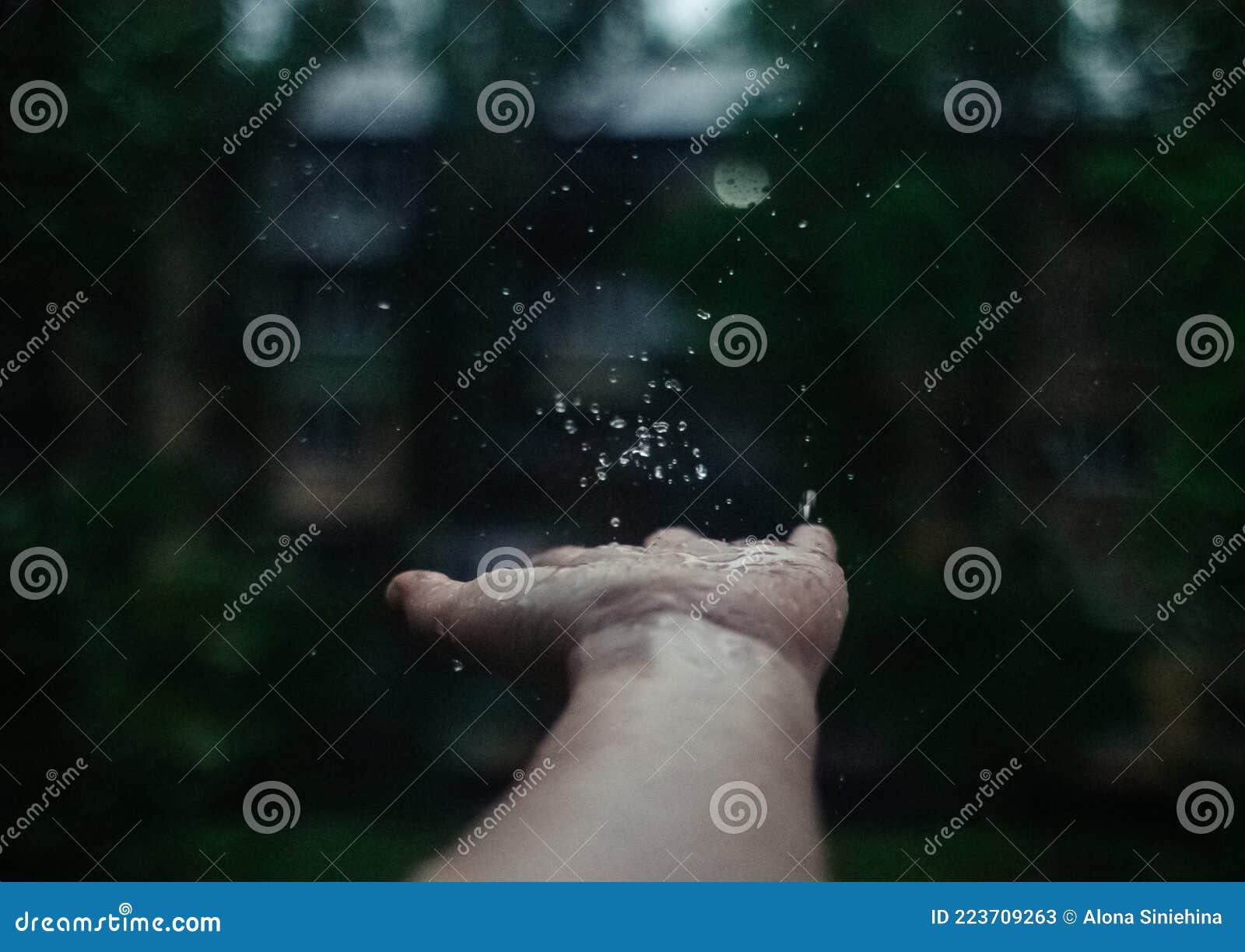 Rain on Hand. Close-up of the Moment when a Stream of Rain Flows into ...
