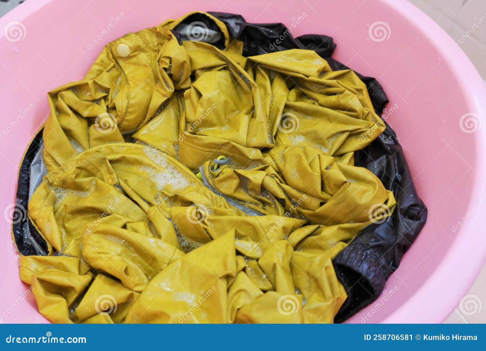 Rain Jacket and Pants Soaked in a Basin Stock Image - Image of soaked ...