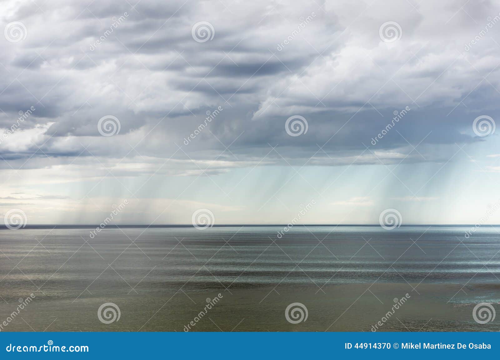 Rain over the sea stock photo. Image of clouds, water - 44914370
