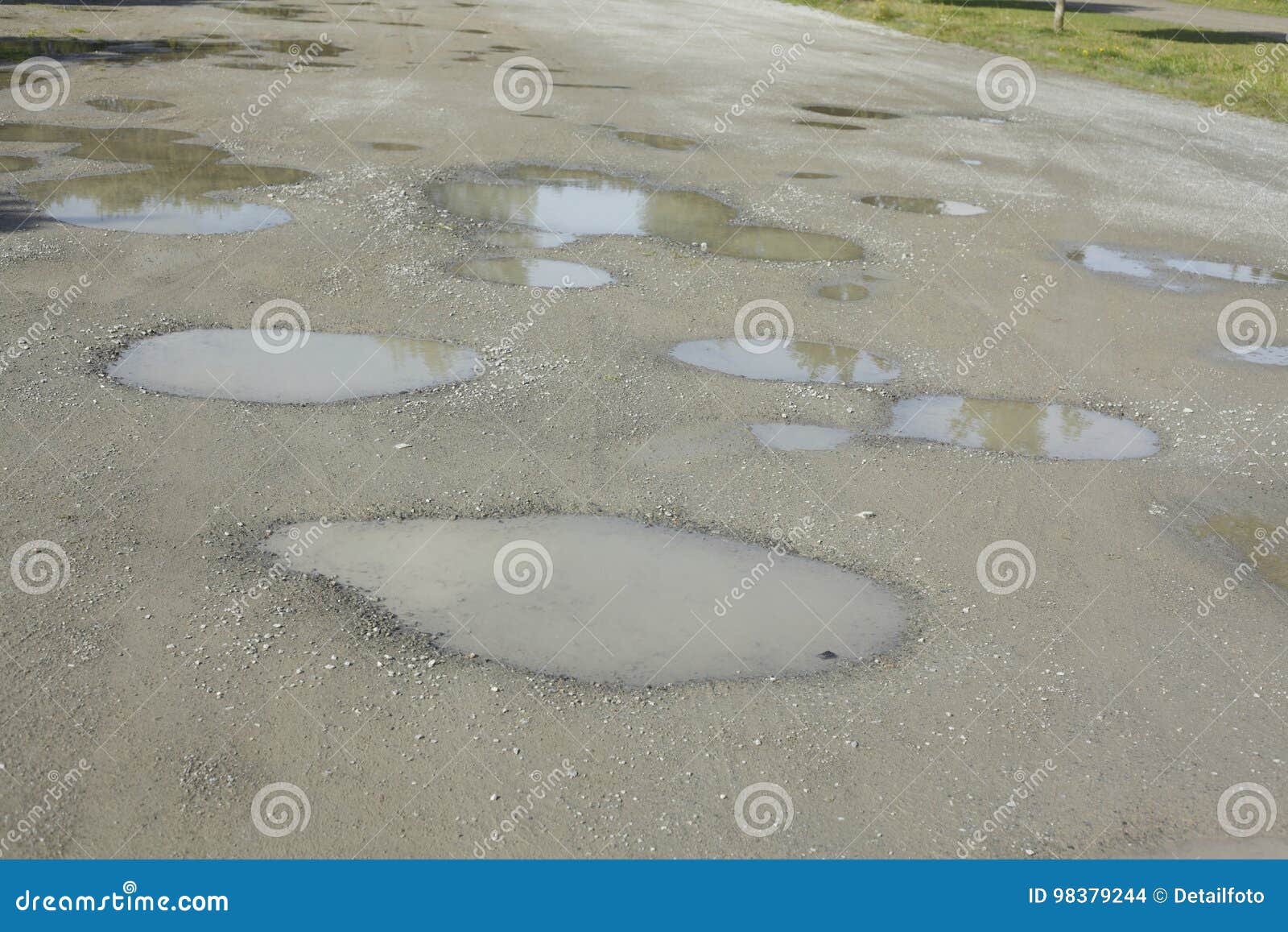 Rain puddles stock photo. Image of rain, puddles, footpath - 98379244