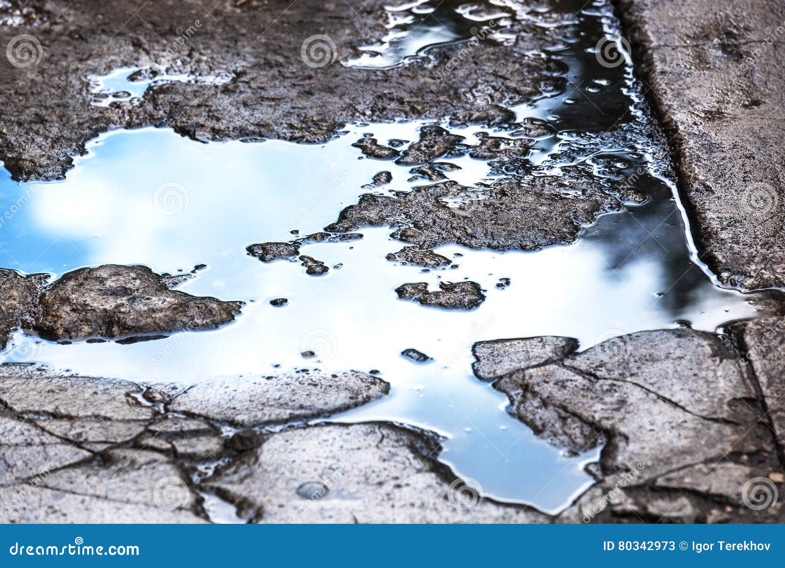 Rain puddles on pavement stock image. Image of outdoors - 80342973