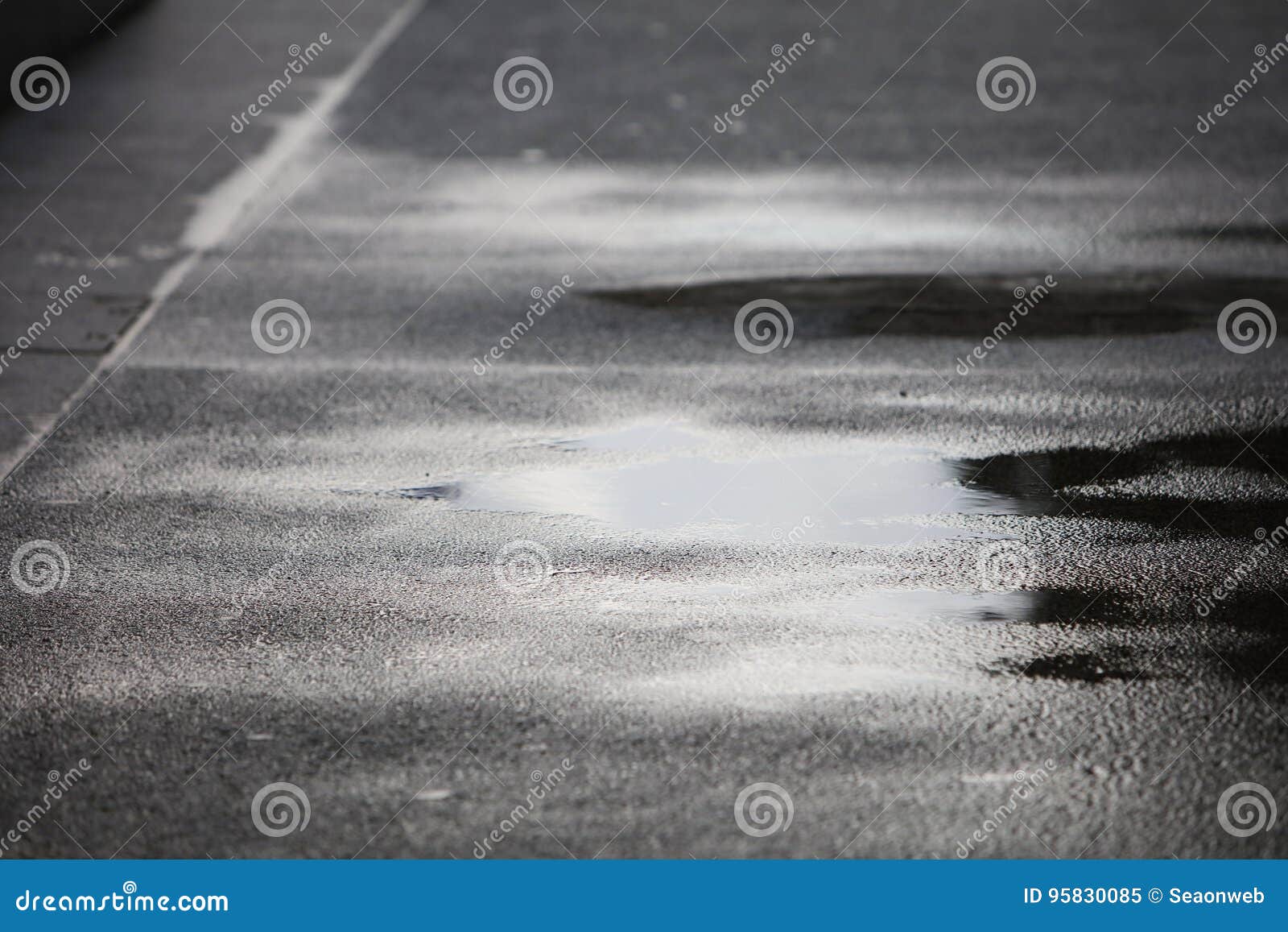 Rain Puddles on a Pavement in the City Stock Image - Image of paving ...