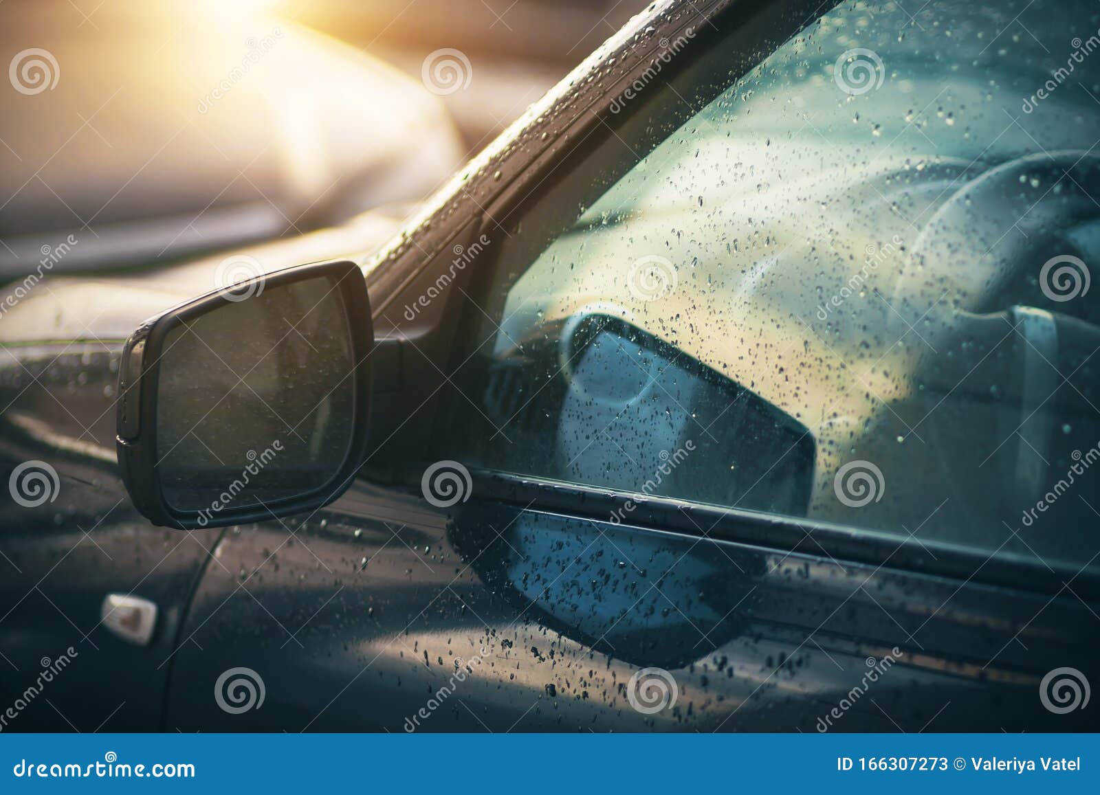 The Rain-soaked Windows and Mirrors of the Car, Which are Illuminated ...