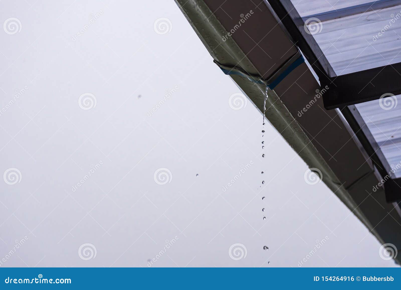 Rain Storm with Metal Sheet Roof,rainwater Flows Down the Roof Stock ...