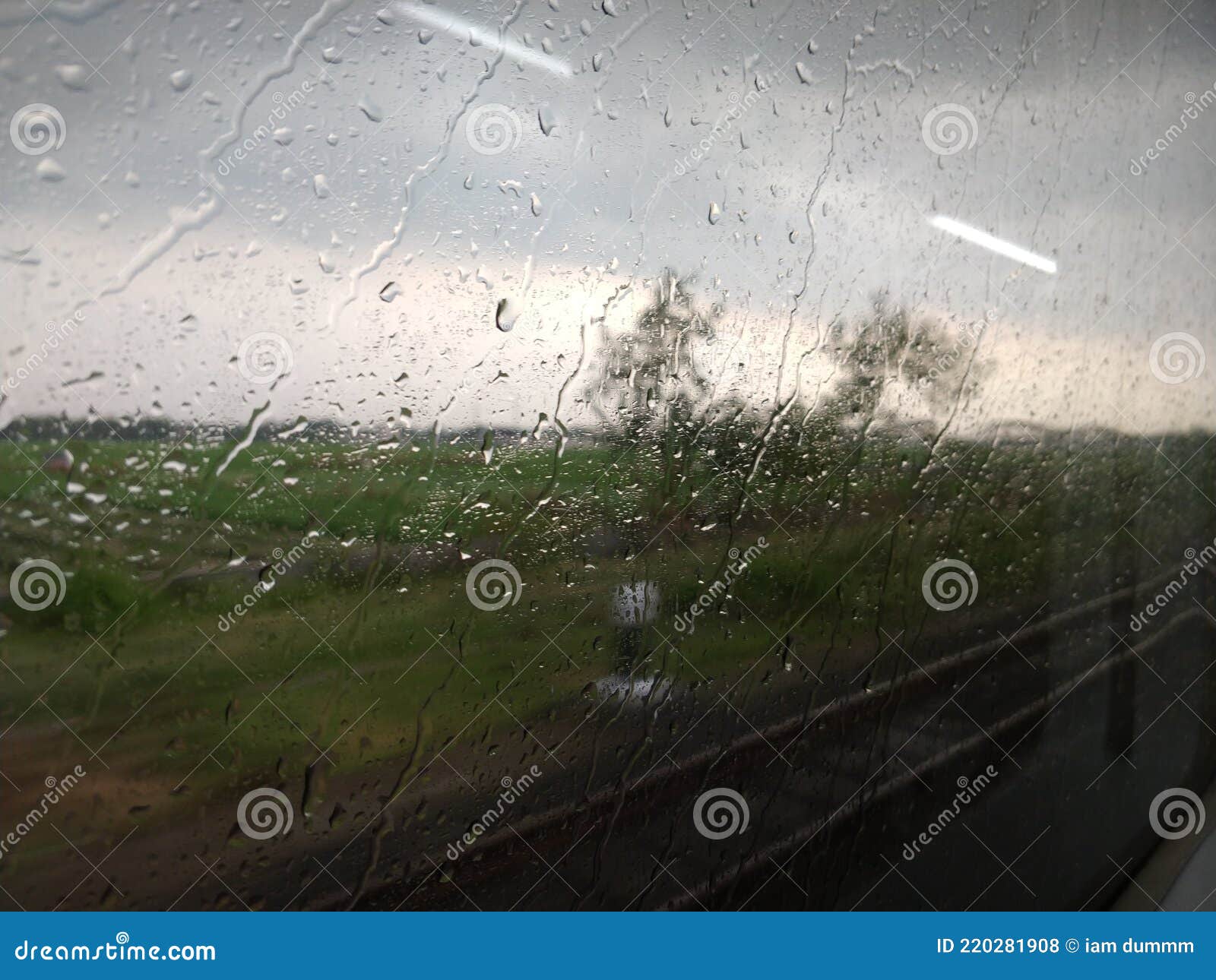 Rain in train stock photo. Image of storm, train, raining - 220281908