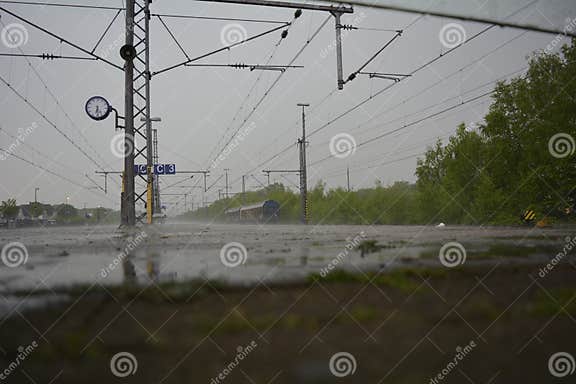 Rain on the train track stock photo. Image of clock, water - 40168904