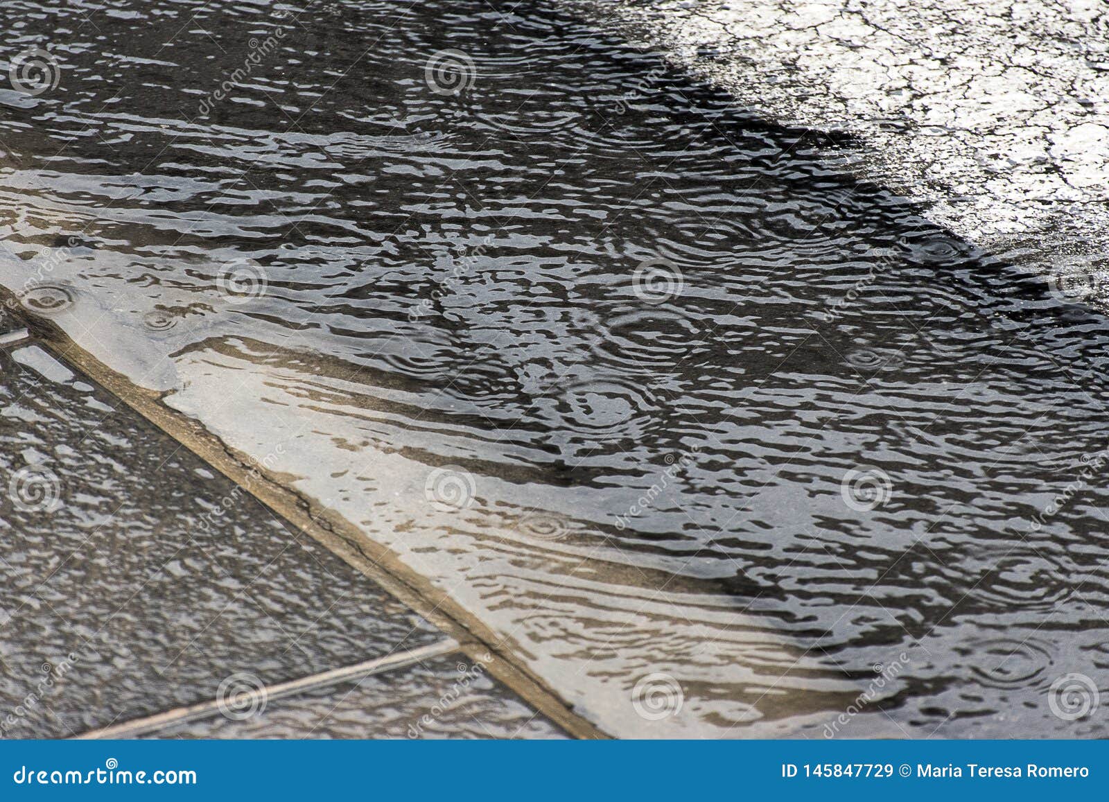 Rain water on the asphalt stock image. Image of bright - 145847729