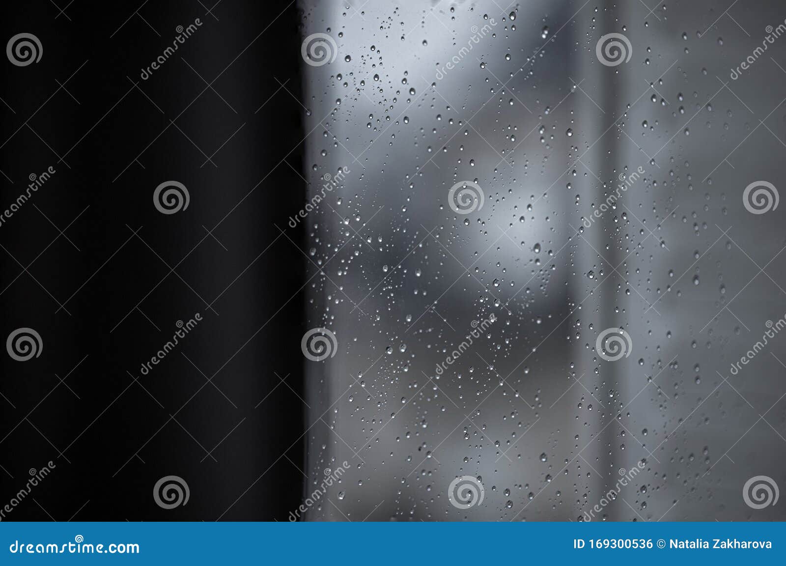 Rain Water Drops on a Black Dramatic Window Glass. Autumn Bokeh ...