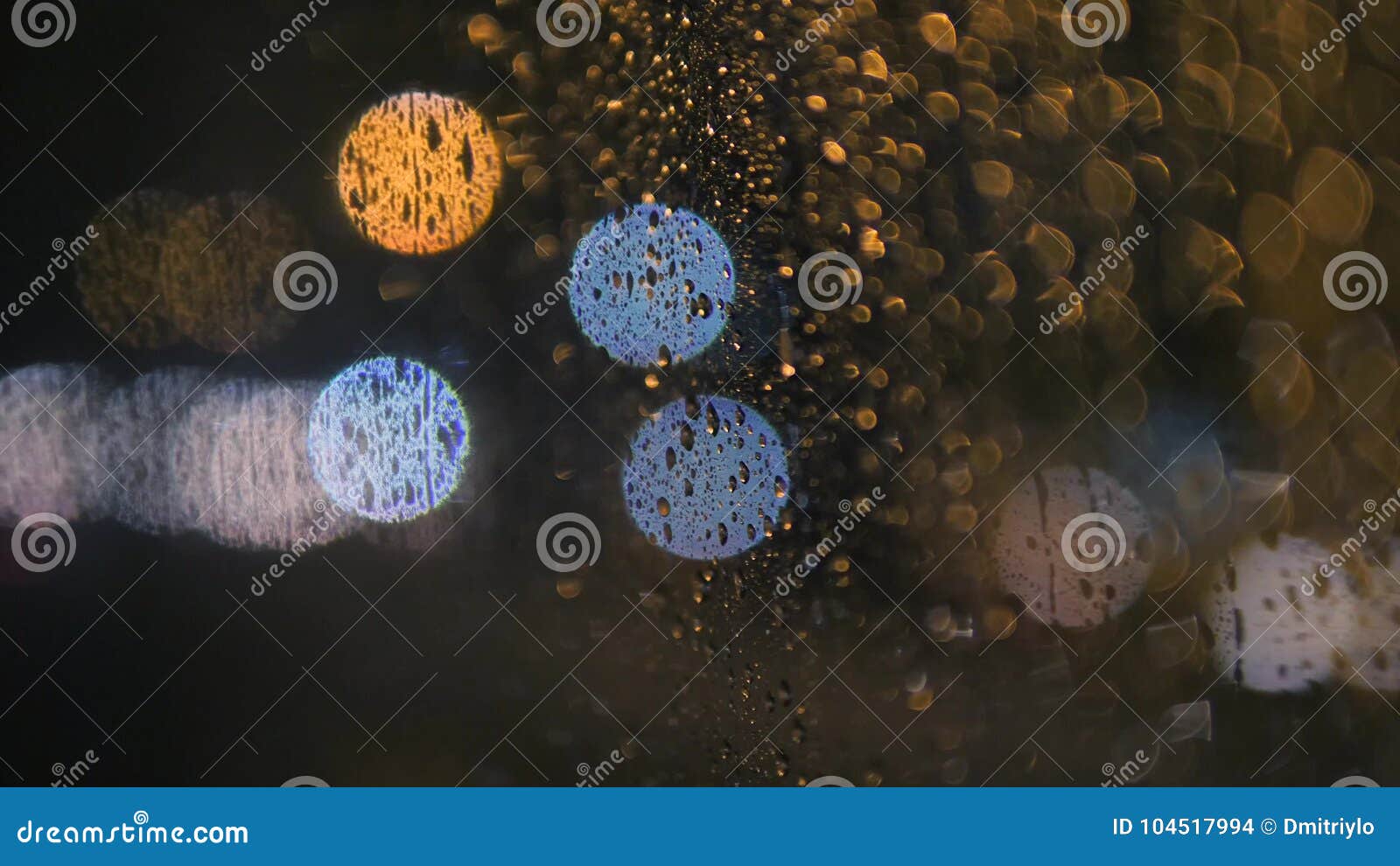 Rain Water Drops On Bus Window Glass In Rainy Day With Blurred Night