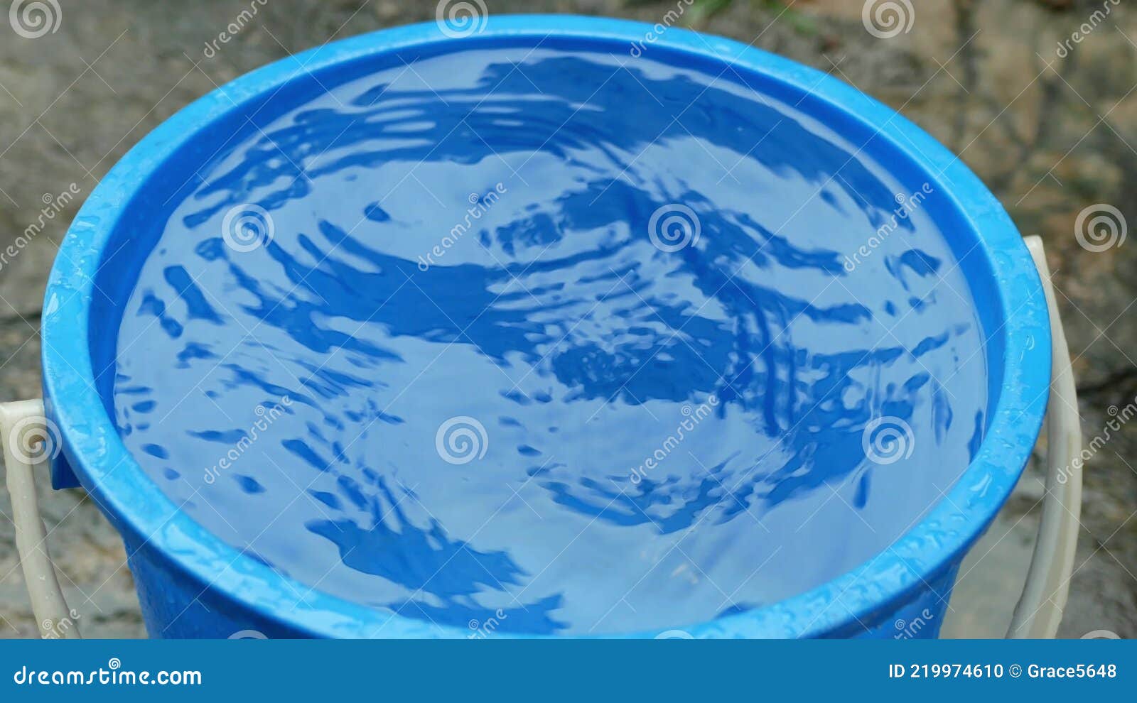 Rain Water Falling from the Roof into the Blue Bucket To Save Water ...