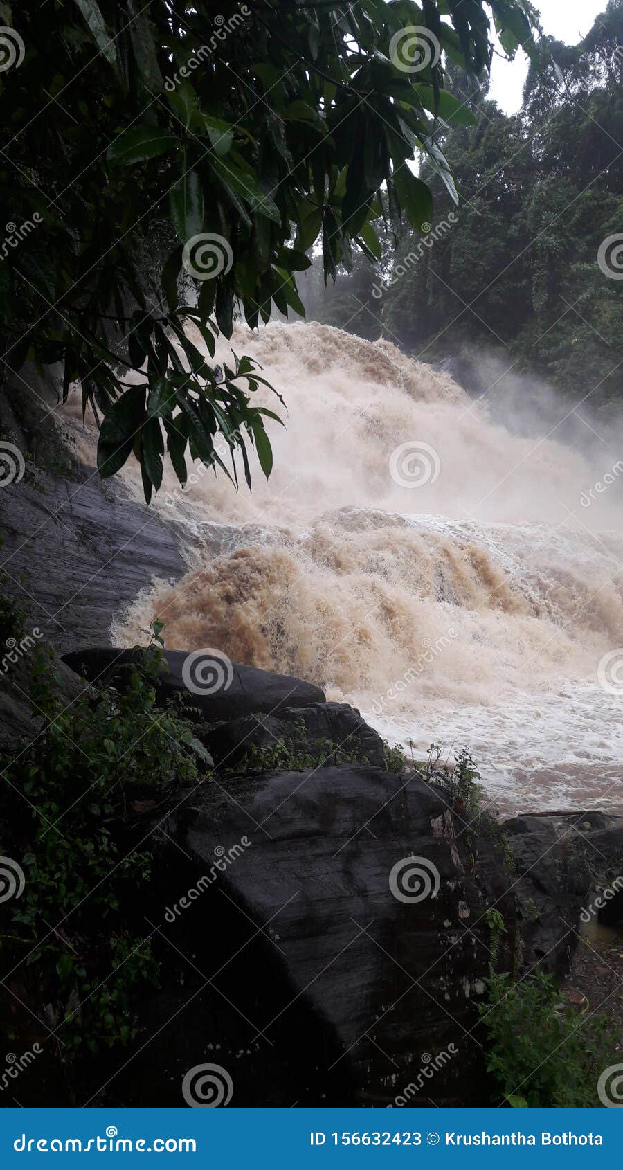 With Rain Water Glides Furiously Down Over the Rocks. Stock Image ...