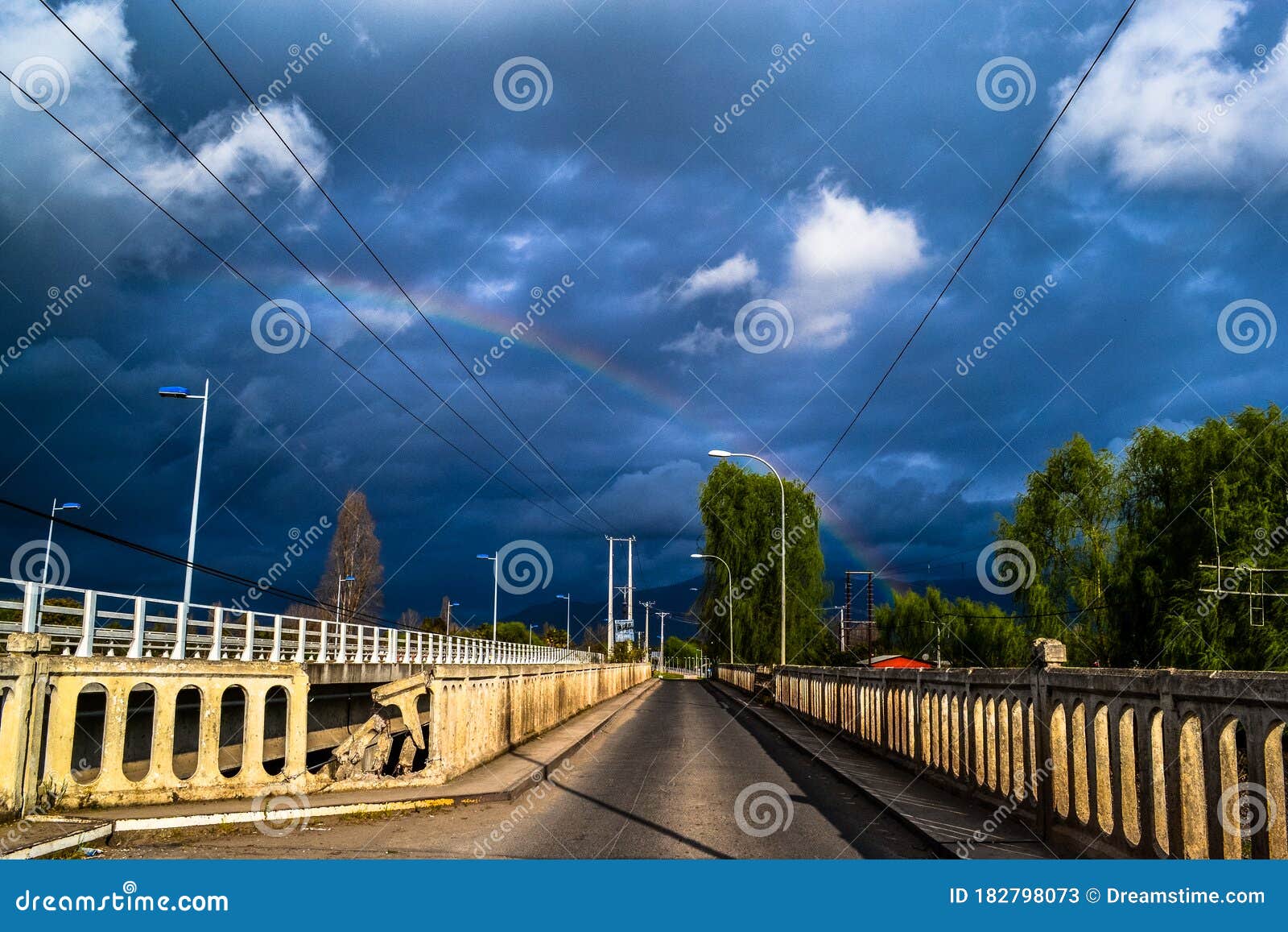 A Rainbow Over the Cloudy Bridge Stock Image - Image of colors, rain ...