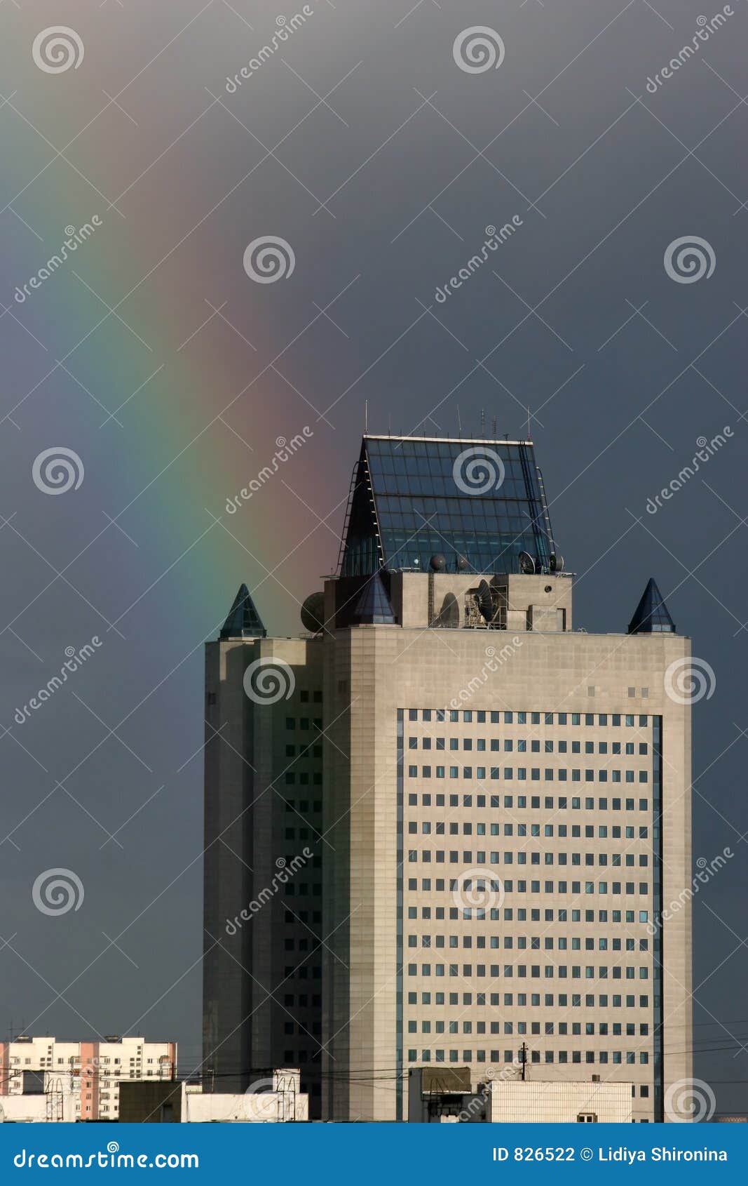 Rainbow above a skyscraper stock photo. Image of green - 826522