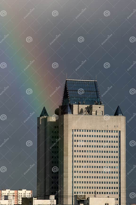 Rainbow above a skyscraper stock photo. Image of green - 826522