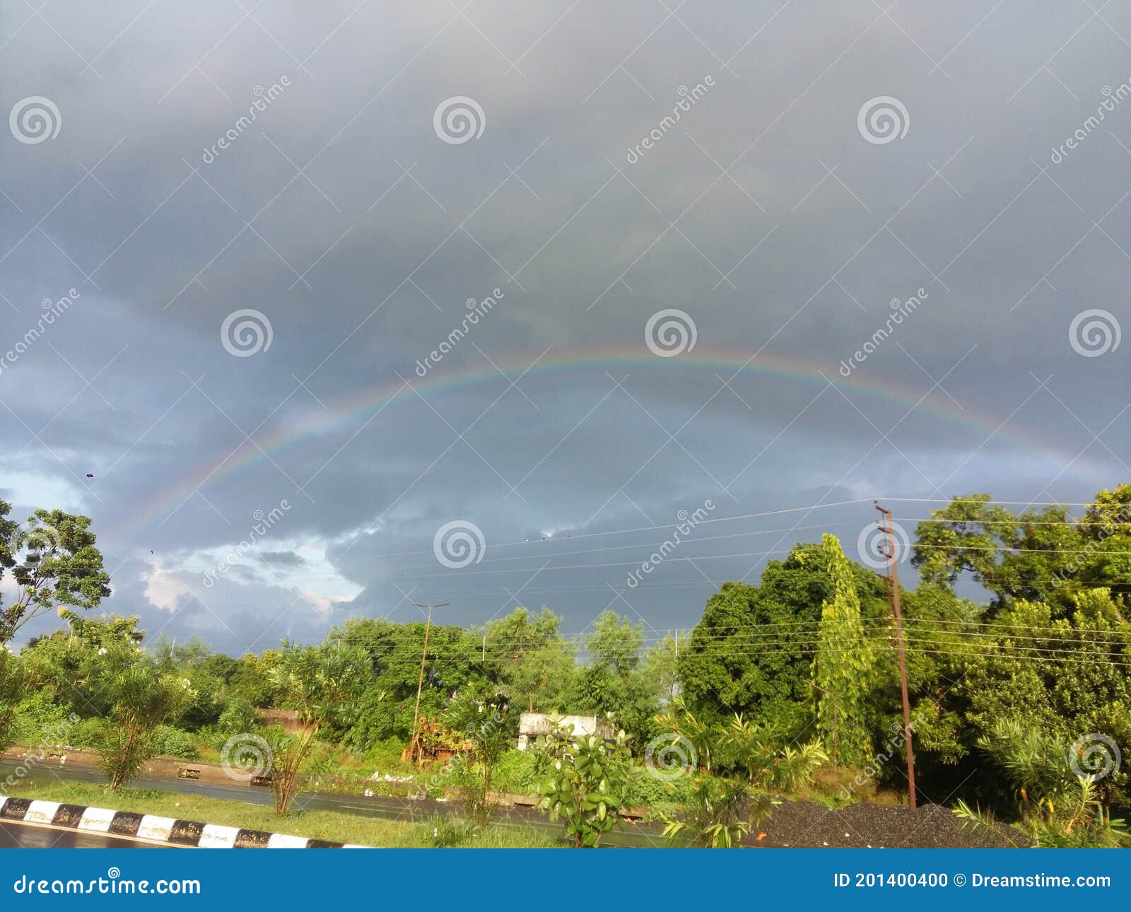 Rainbow in the Sky from India Stock Photo - Image of trees, looking ...