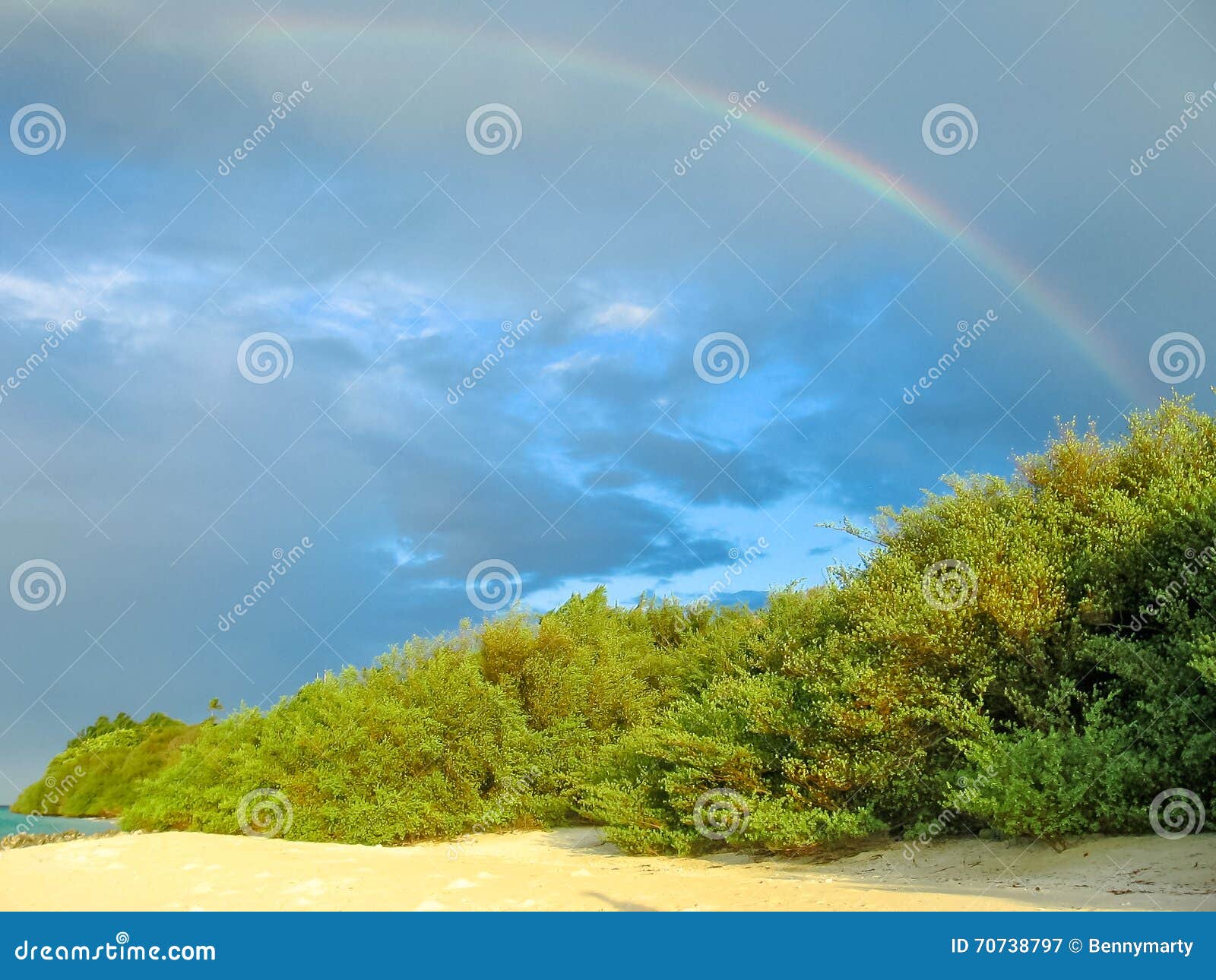 Rainbow on the beach stock image. Image of colors, landscape - 70738797