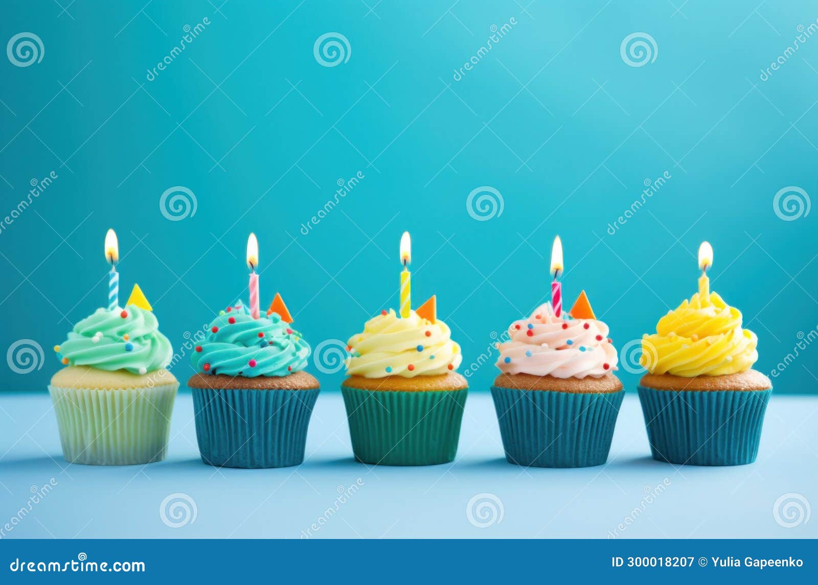 Rainbow Birthday Cupcakes on Blue Background Stock Image - Image of ...