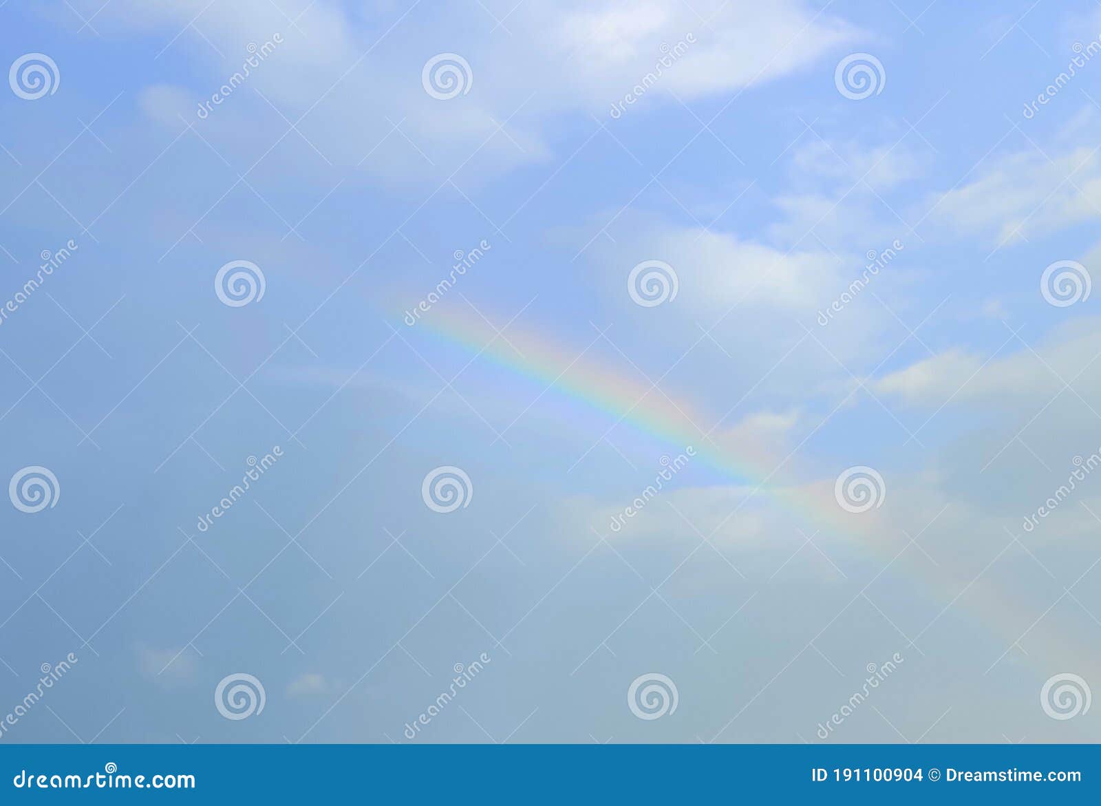 Rainbow in the blue sky stock photo. Image of storm - 191100904
