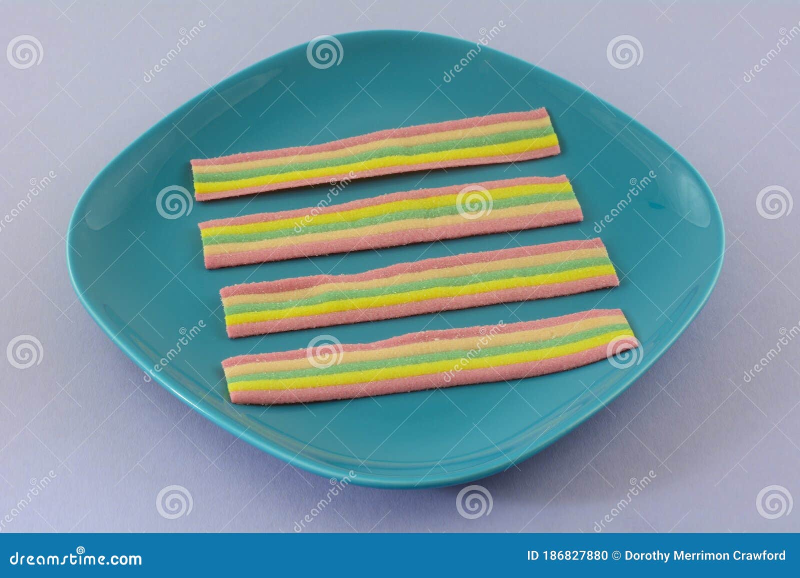 Rainbow candy strips stock photo. Image of sweet, plate - 186827880