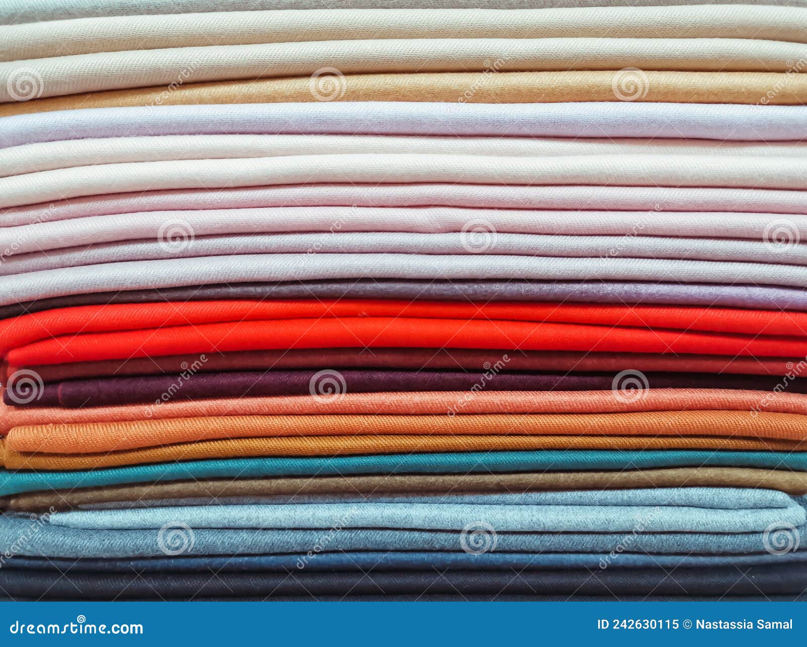 Rainbow Clothes Background. Pile of Bright Folded Clothes Stock Image ...