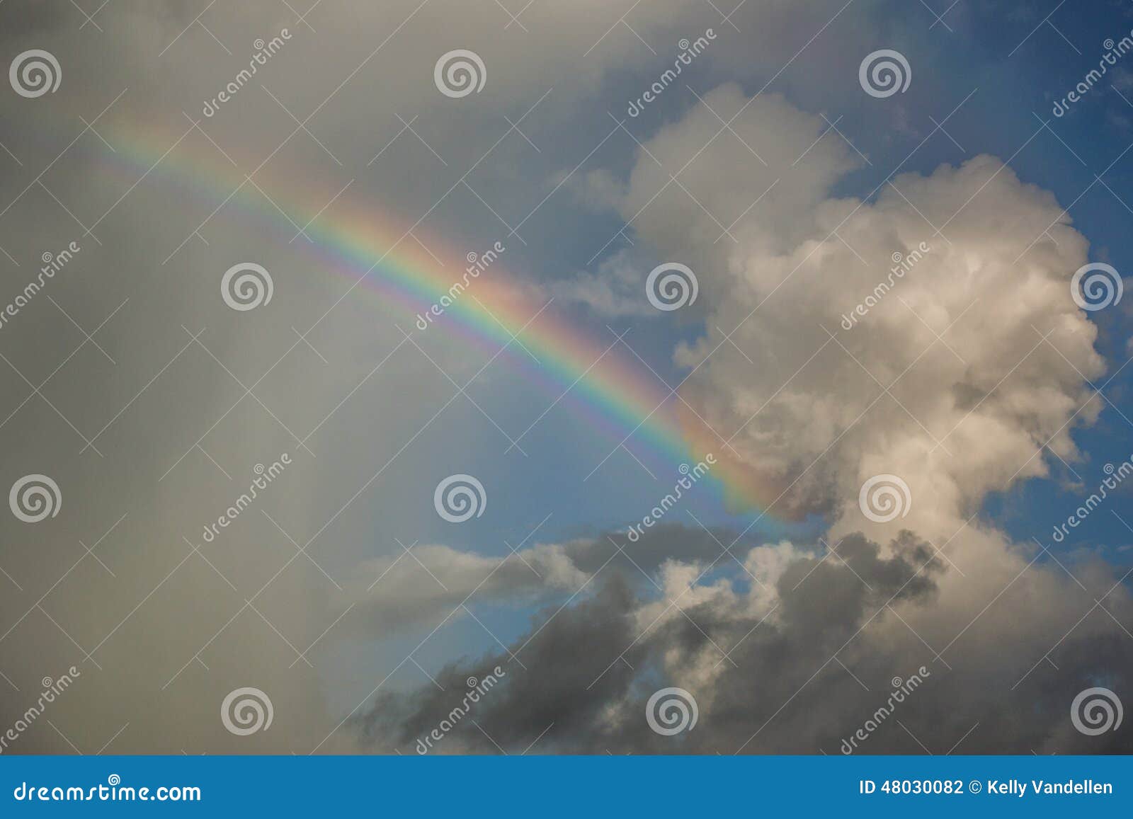 Rainbow on cloudy day stock photo. Image of arch, horizontal - 48030082