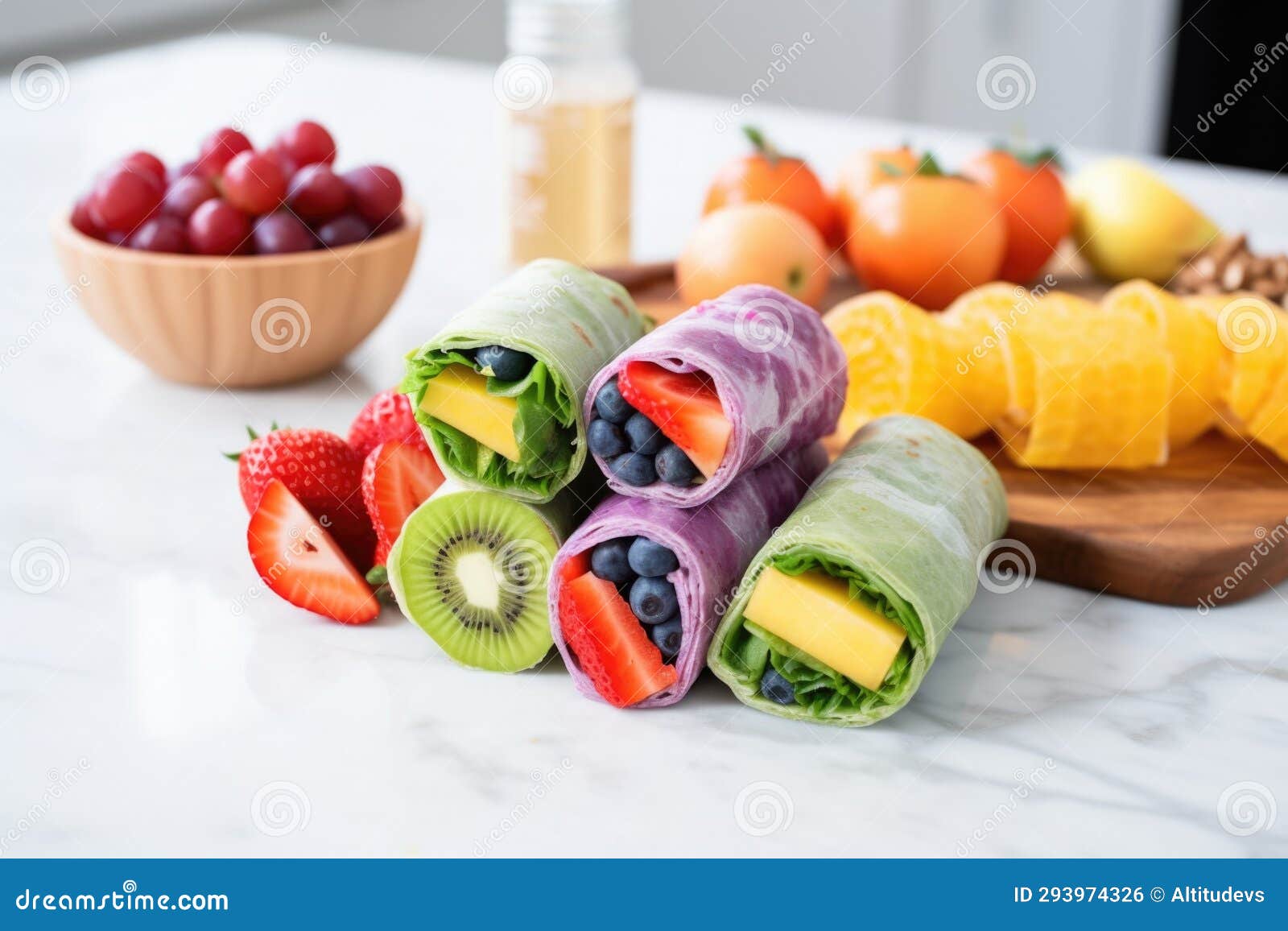 Rainbow-colored Fresh Fruit Wraps on a White Marble Countertop Stock ...