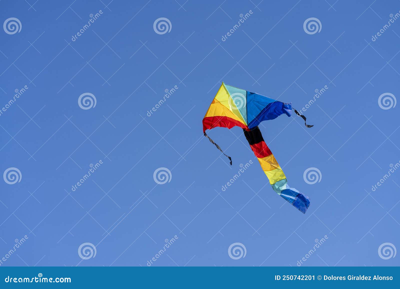 Rainbow colored kite stock image. Image of flight, happy - 250742201
