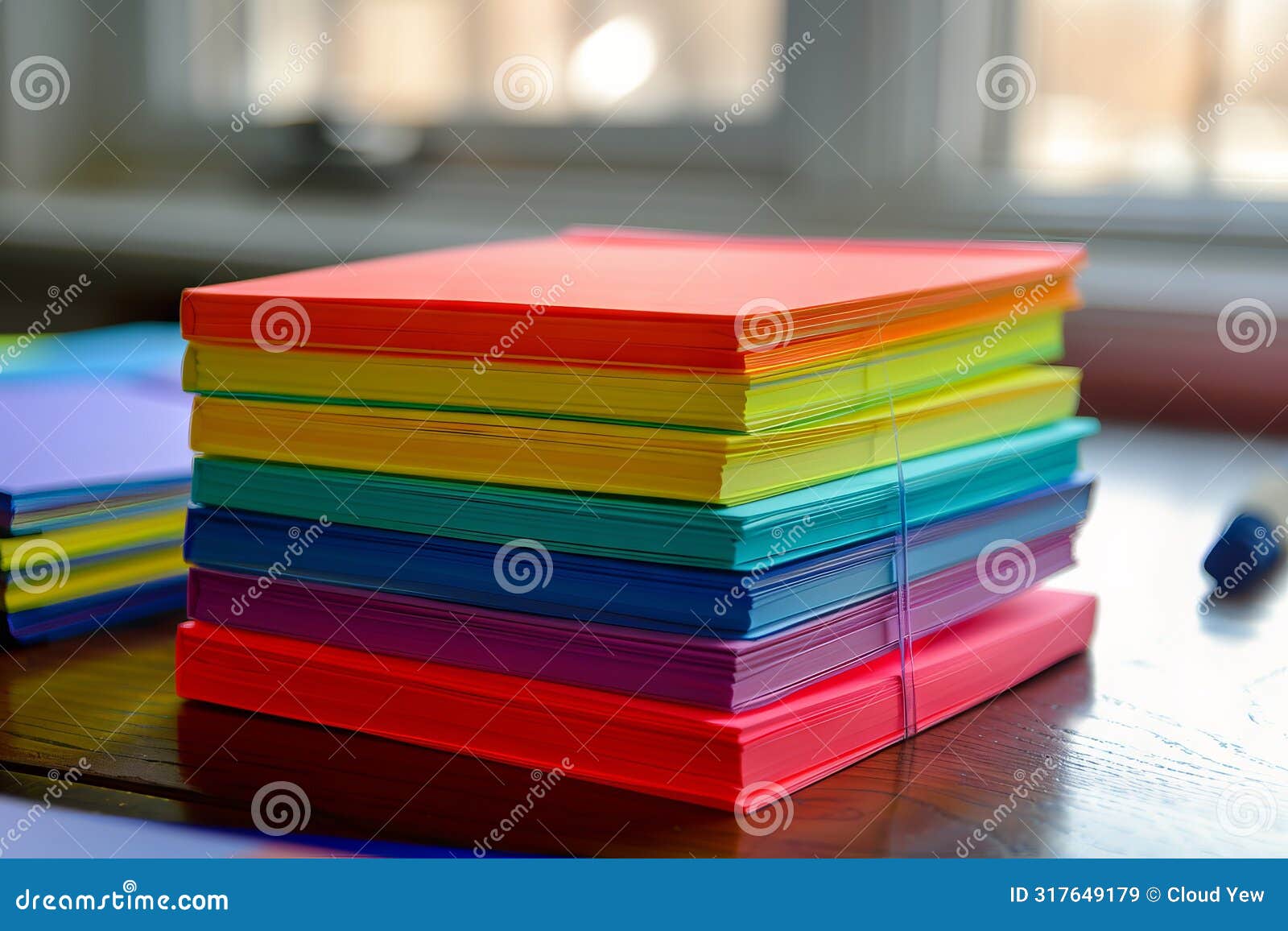 Rainbow-colored Notepads Transparently Stacked on a Desk Stock ...