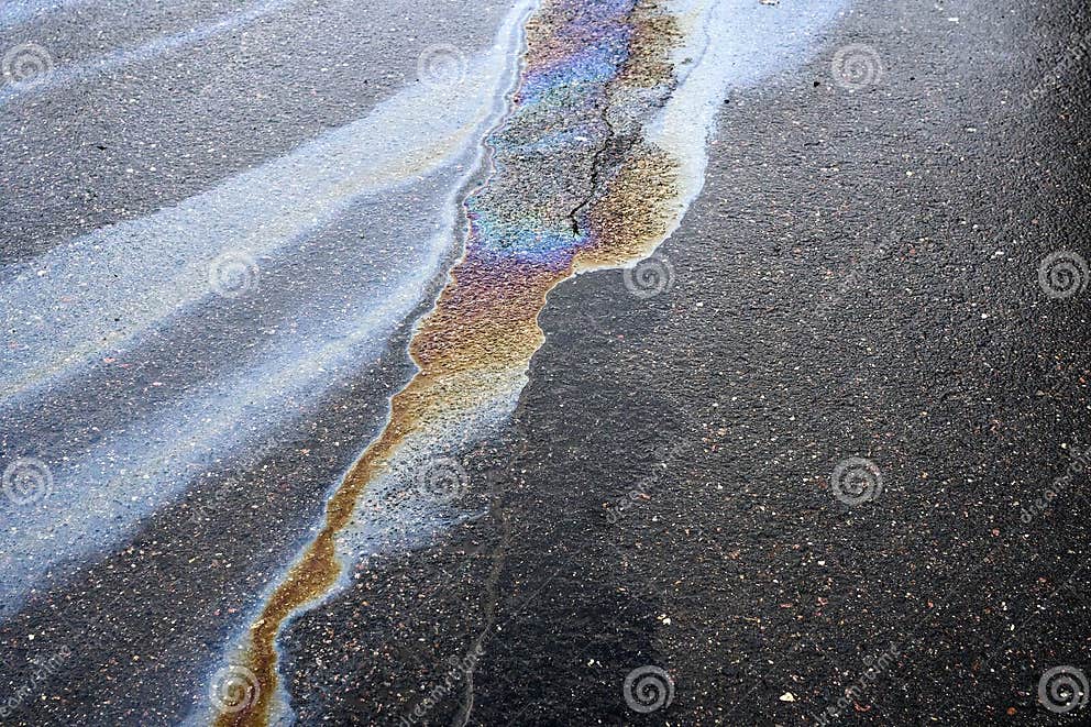 A Rainbow Colored Oil Spill Creates a Striking Rainbow Effect on a ...