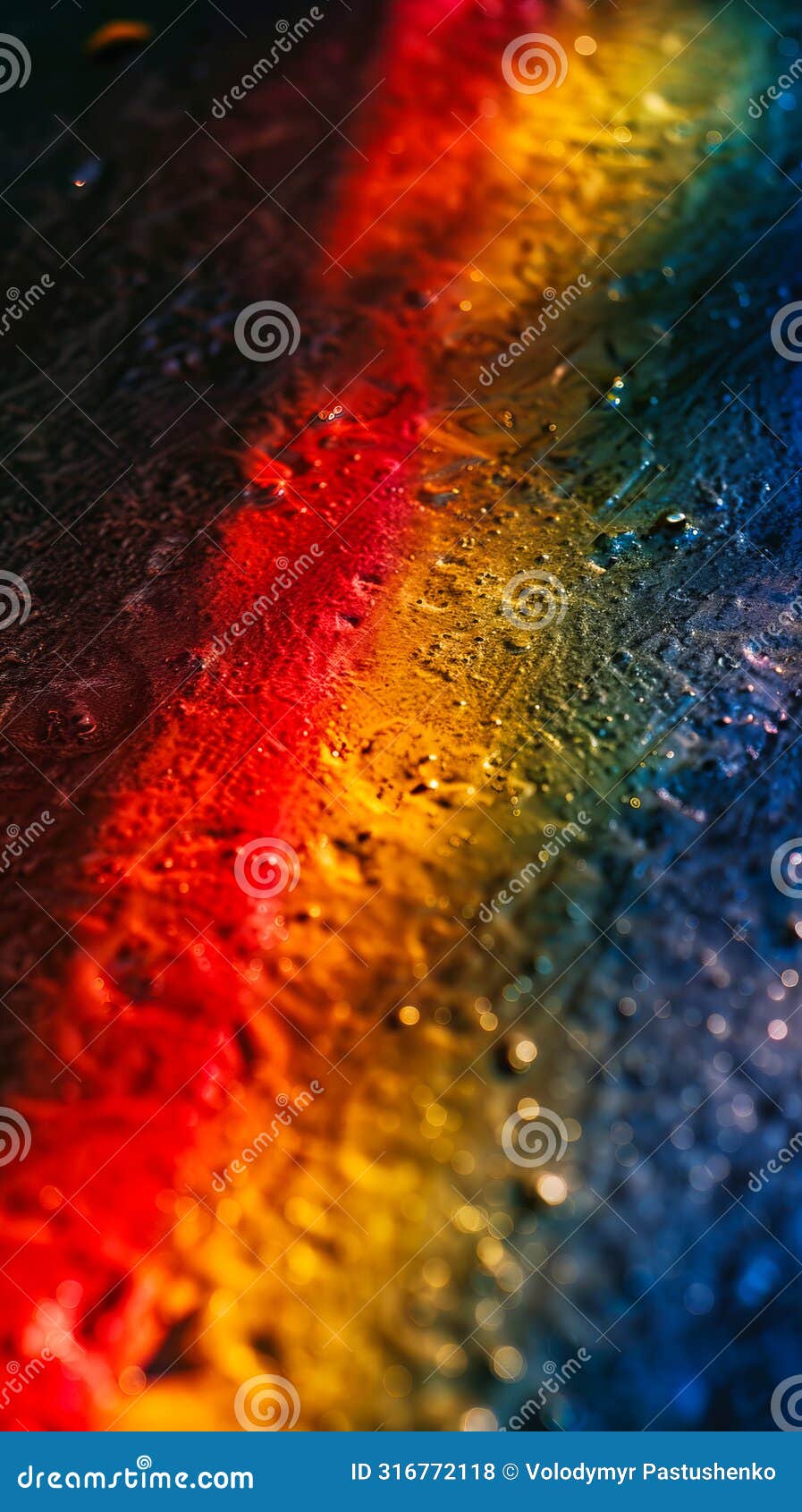 A Rainbow Colored Water Drop on the Ground Stock Photo - Image of water ...