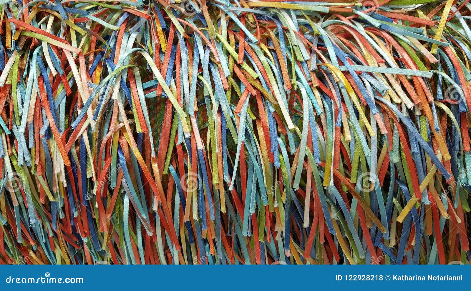 A Rainbow of Colorful Strands of Ribbons and Threads Stock Photo ...
