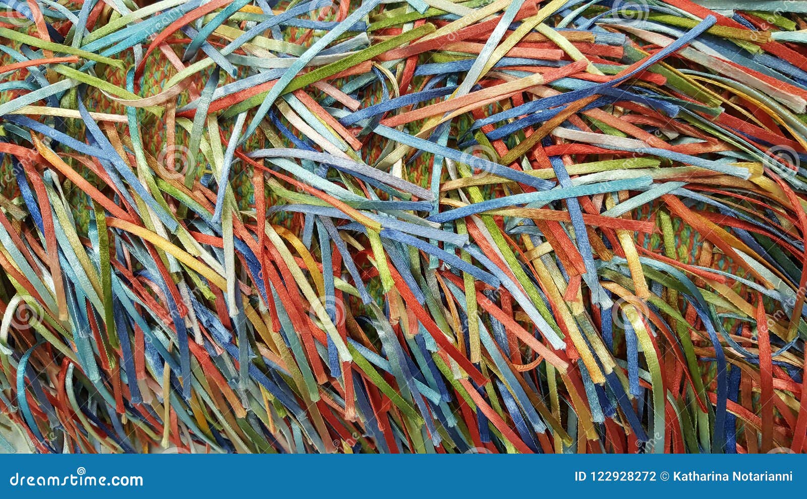 A Rainbow of Colorful Strands of Ribbons and Threads Stock Photo ...