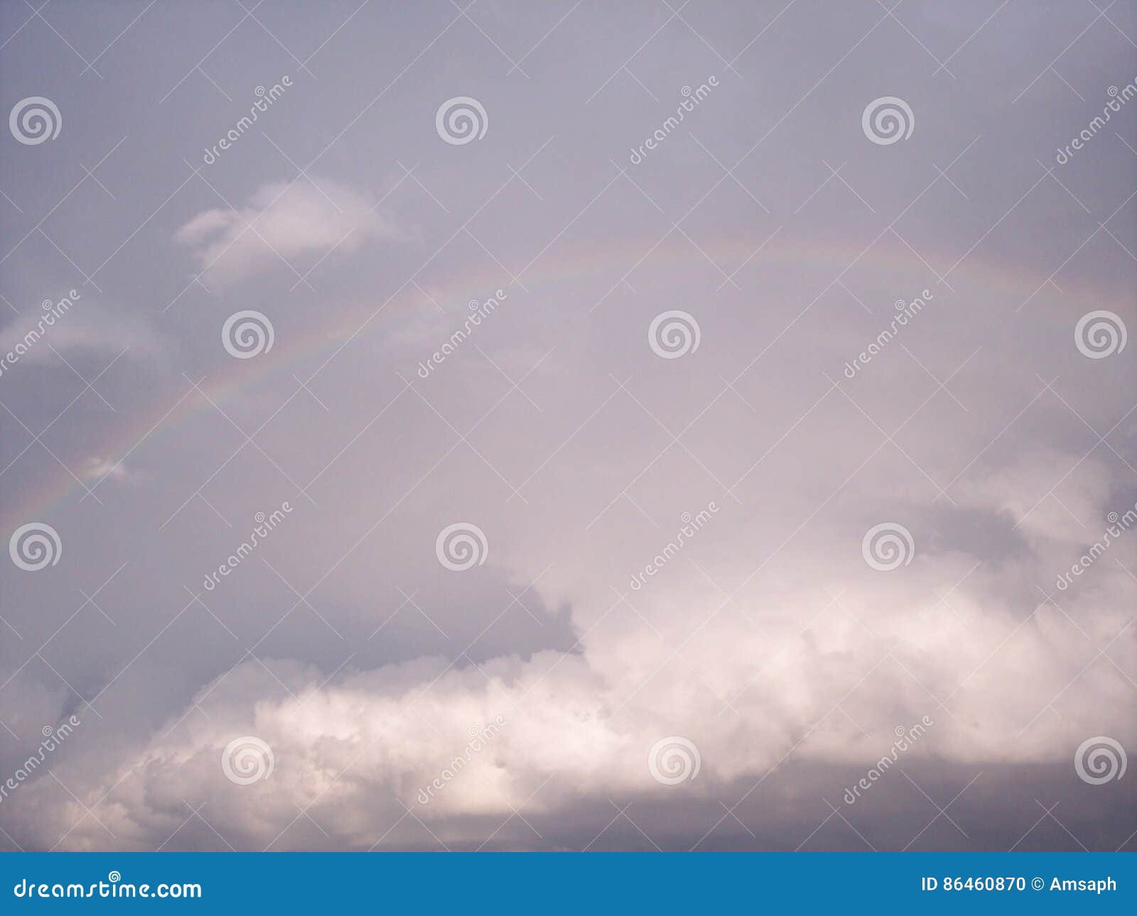 Rainbow and dark clouds stock photo. Image of spring - 86460870