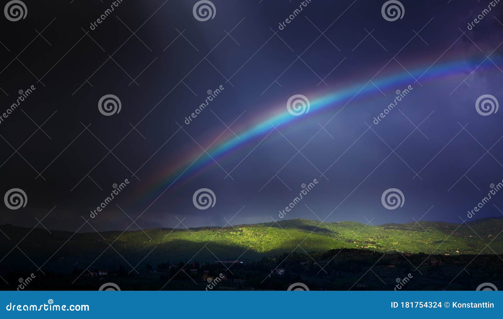 Rainbow in Dramatic Dark Sky Over Green Hillside; Beautiful Summer ...