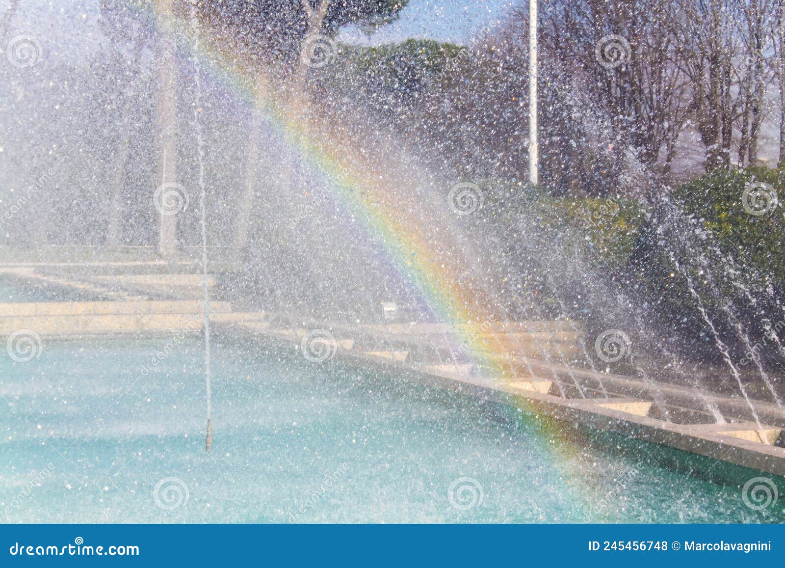 Rainbow Effect on Waterdrops Fountain Stock Photo - Image of park, blue ...