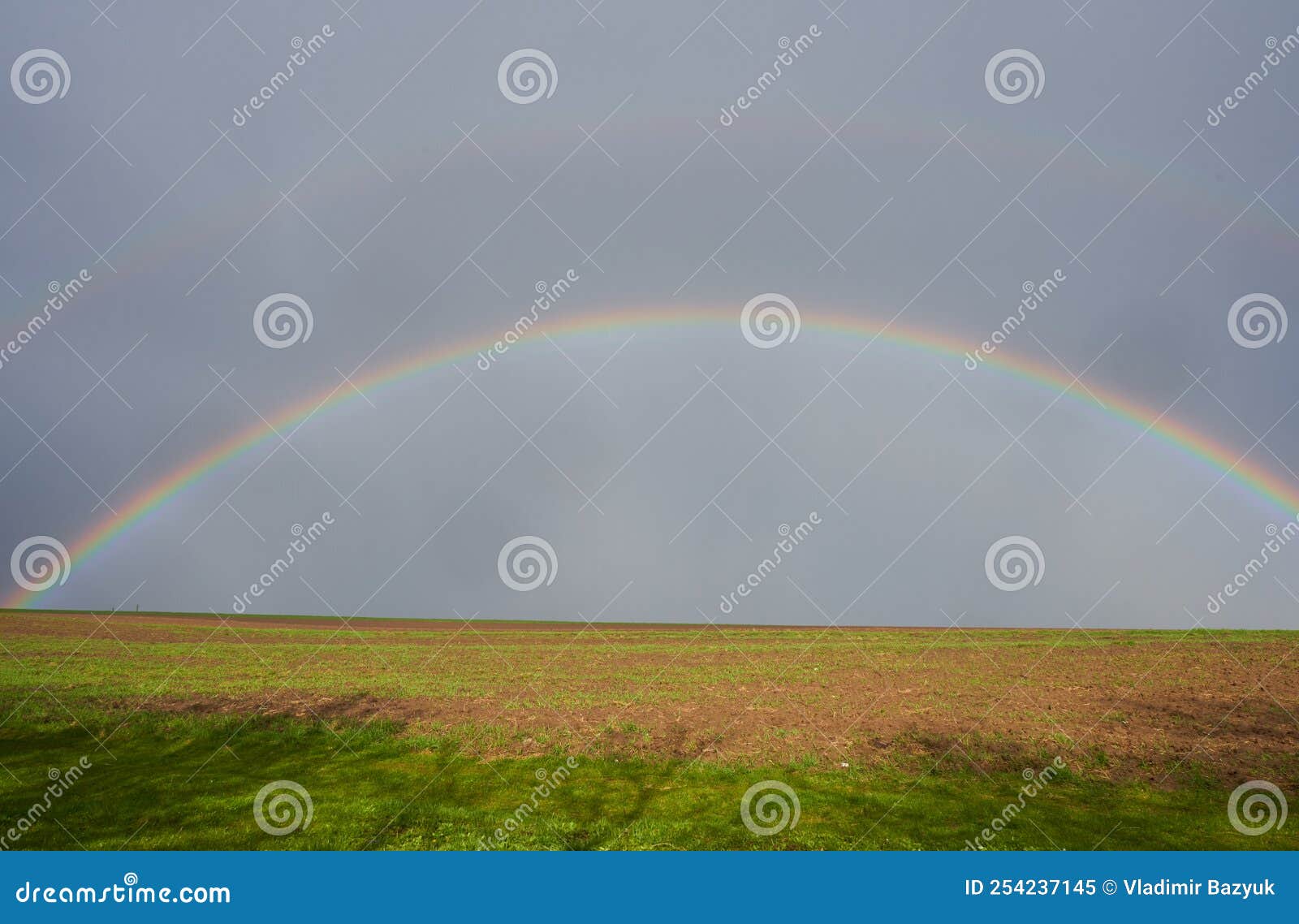 Rainbow in the Field,a Rainbow Appeared in the Sky in the Field in ...