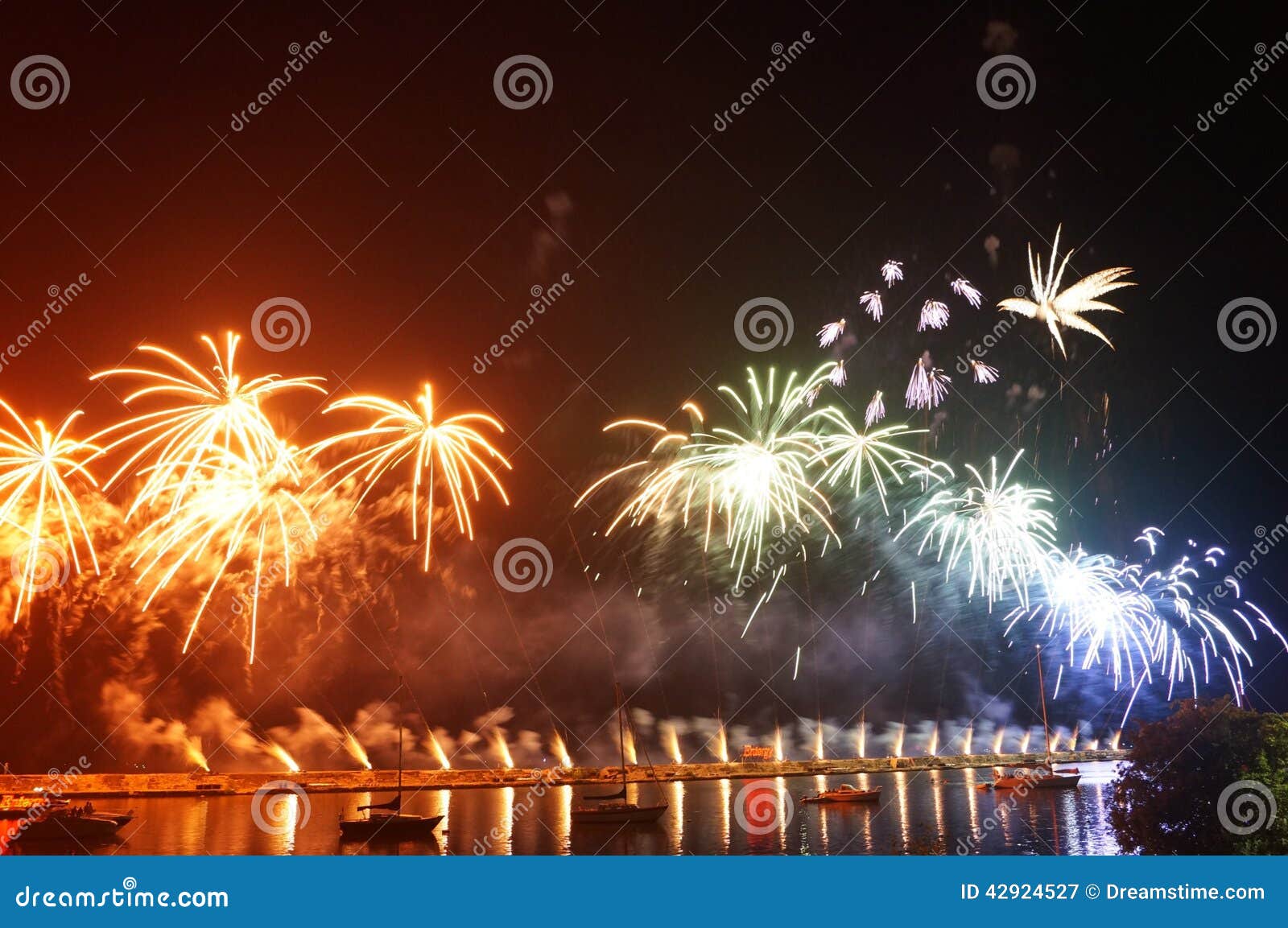 Rainbow fireworks! stock image. Image of festival, reflection - 42924527