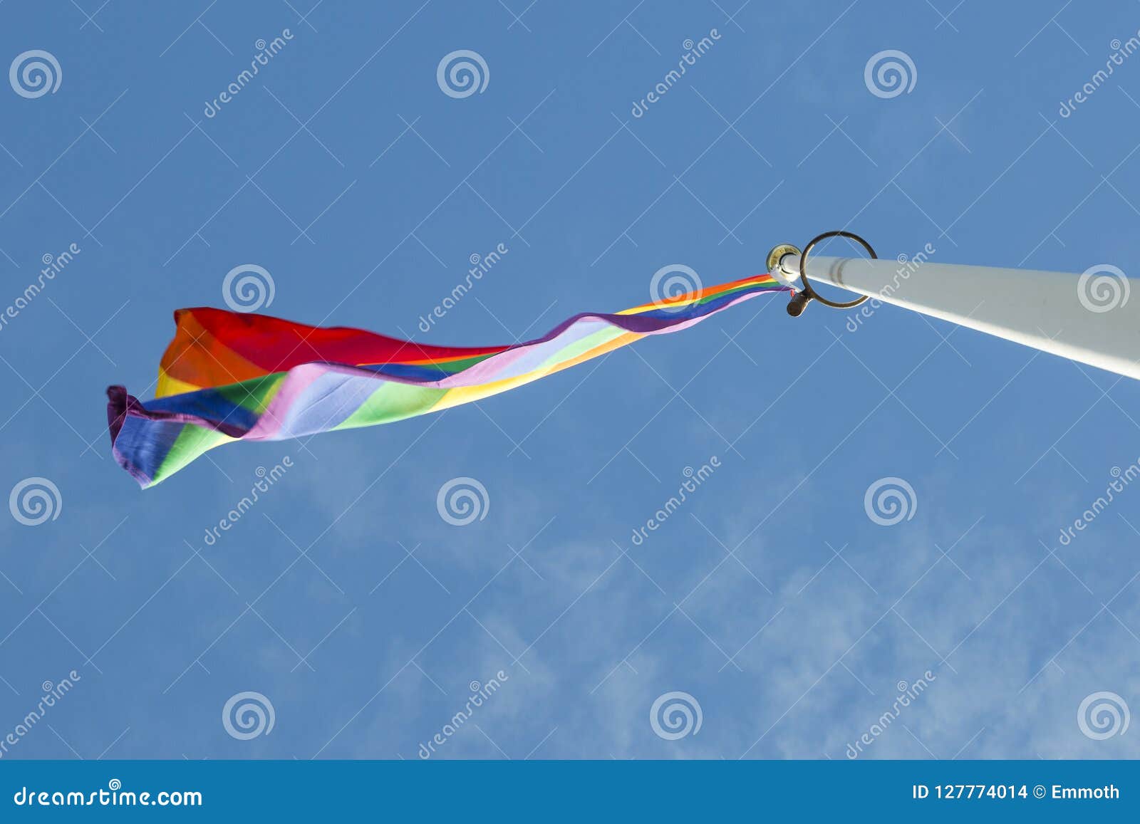 Rainbow Flag Waving in the Wind Stock Photo - Image of clouds, yellow ...